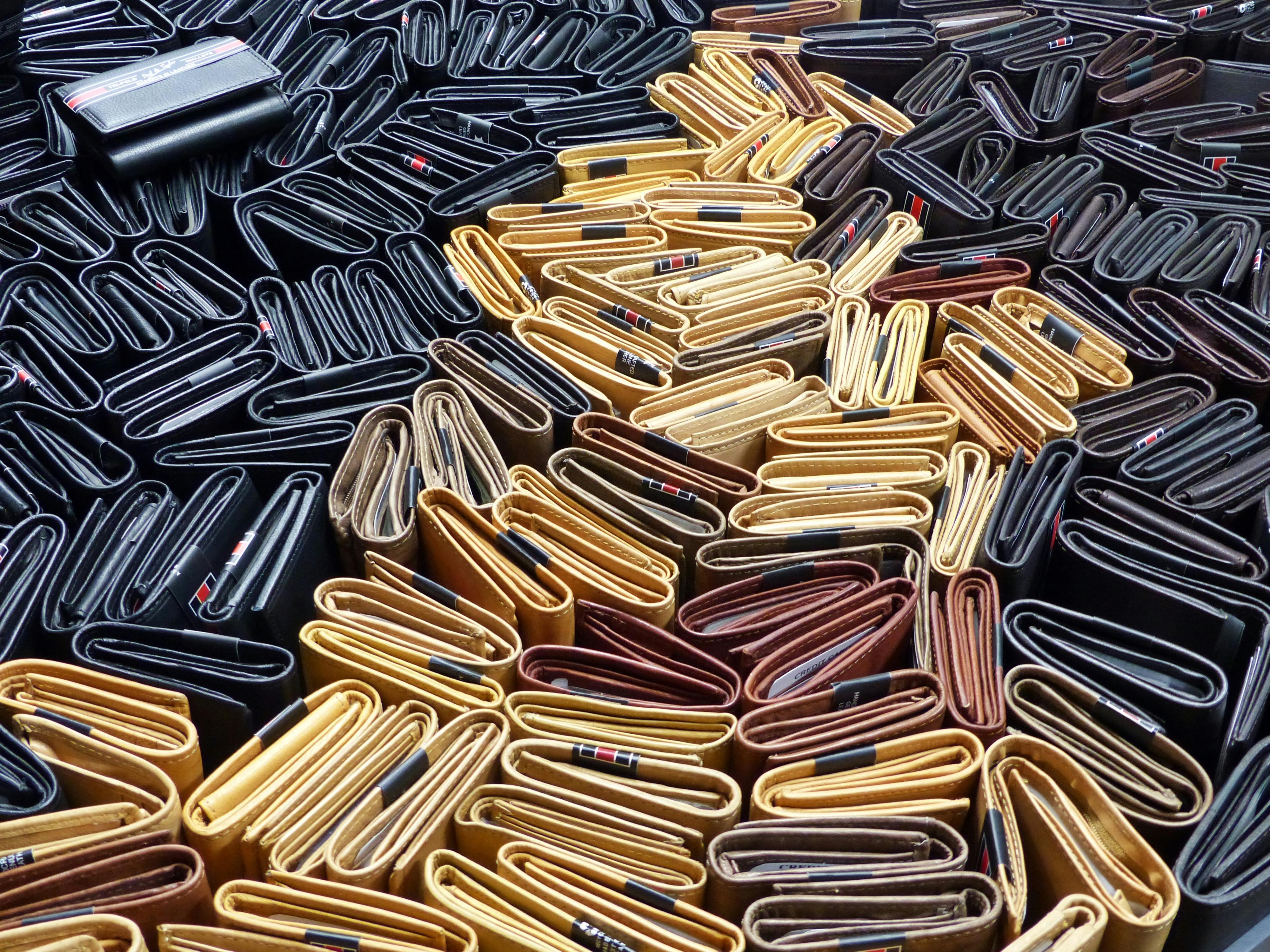 Colorful Array of Leather Wallets in Display · Free Stock Photo