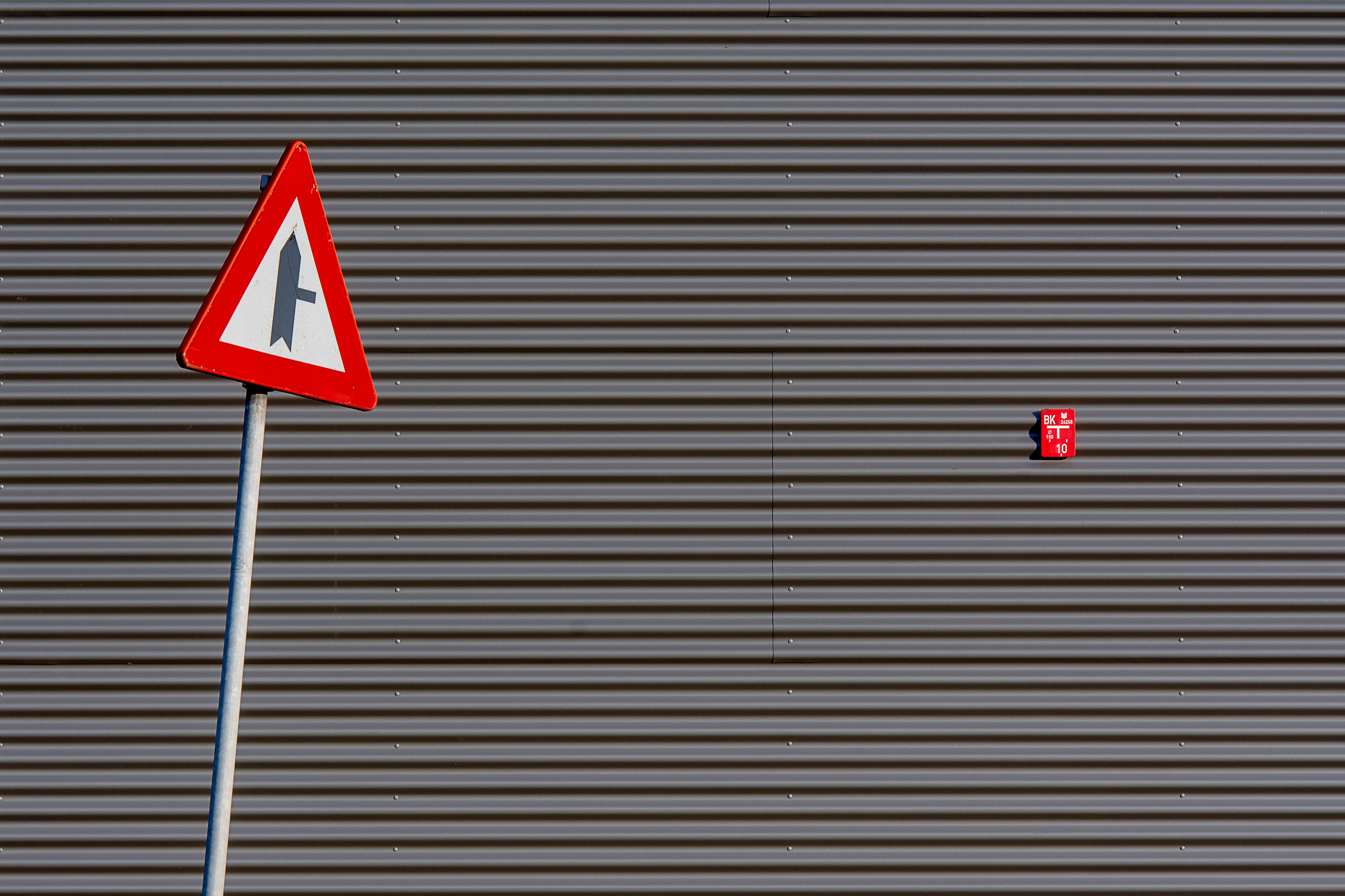 Industrial Warning Sign on Metal Wall · Free Stock Photo