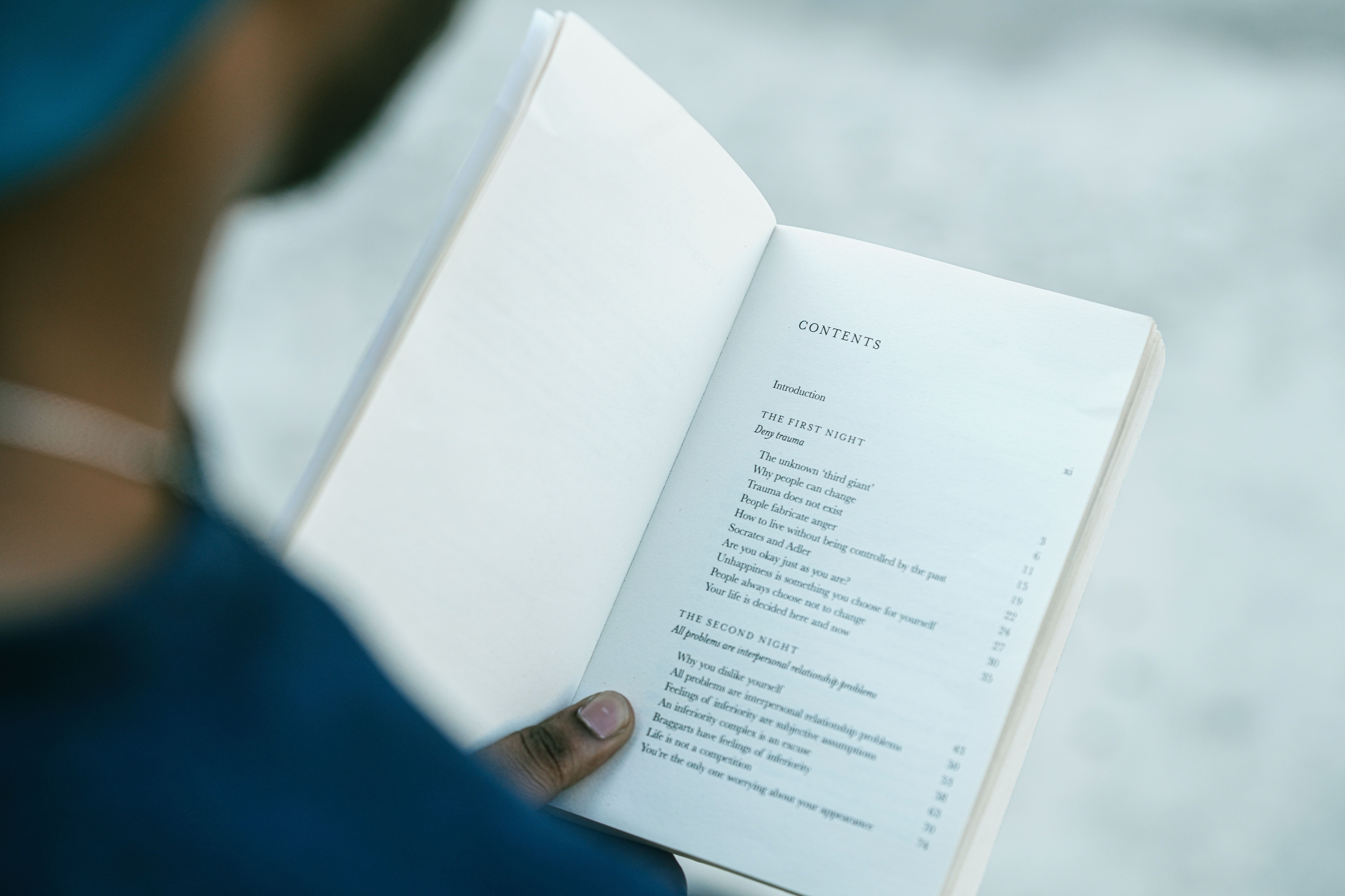 Hands Holding Open Book with Table of Contents · Free Stock Photo