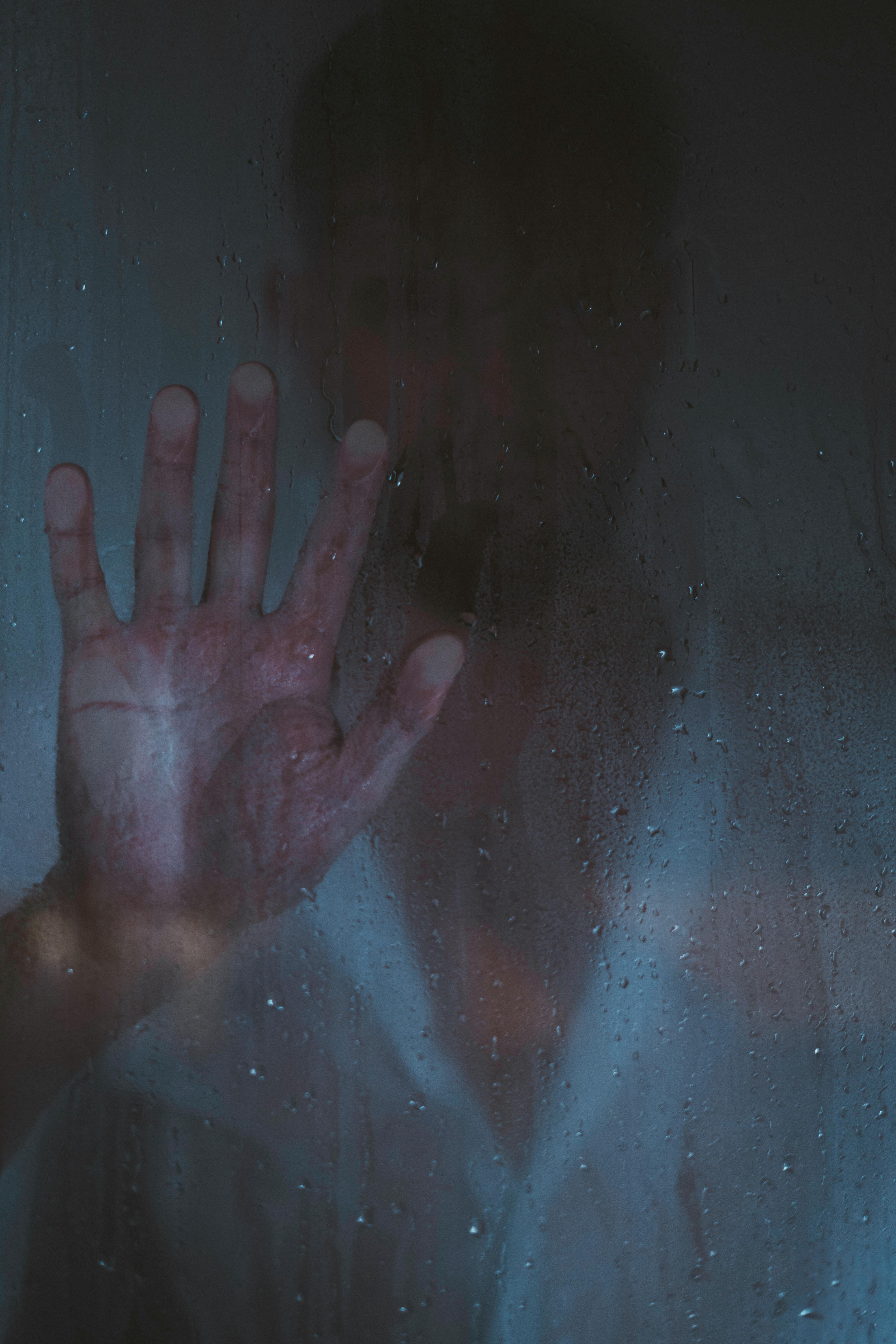 Moody Silhouette of a Man Behind Steamy Glass · Free Stock Photo