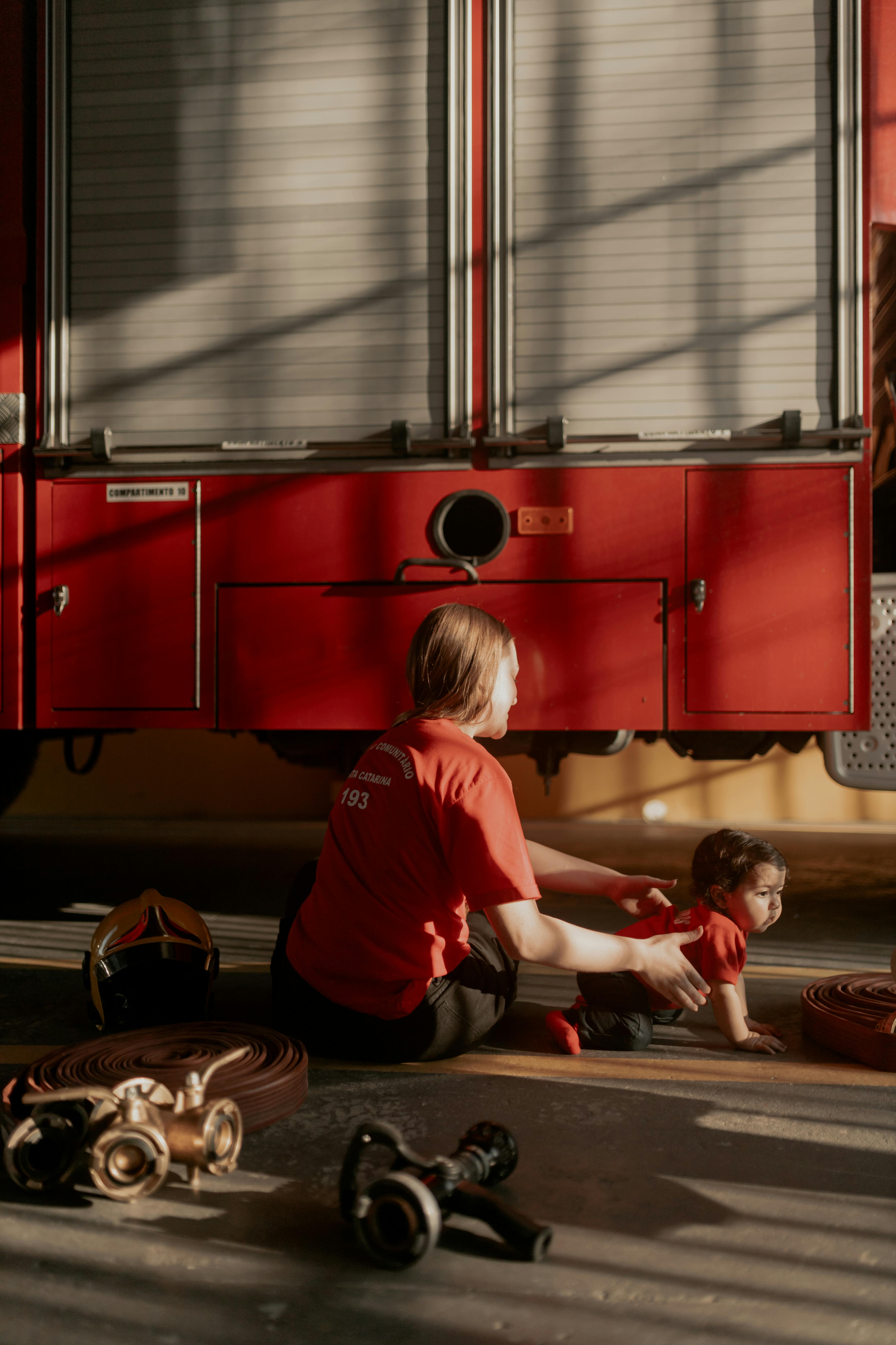Firefighter Mother and Child Bonding · Free Stock Photo