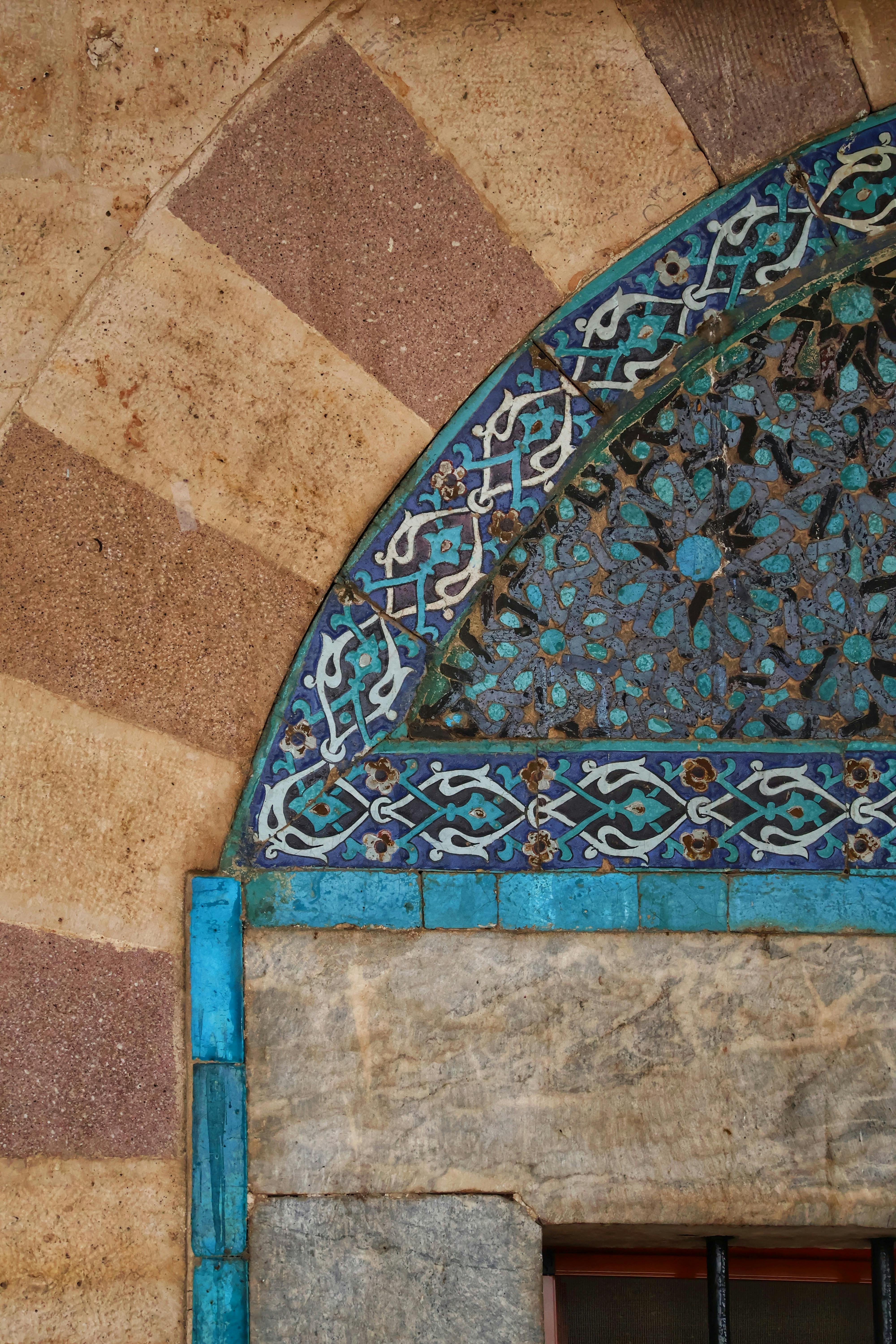 Intricate Middle Eastern Mosaic on Stone Wall · Free Stock Photo