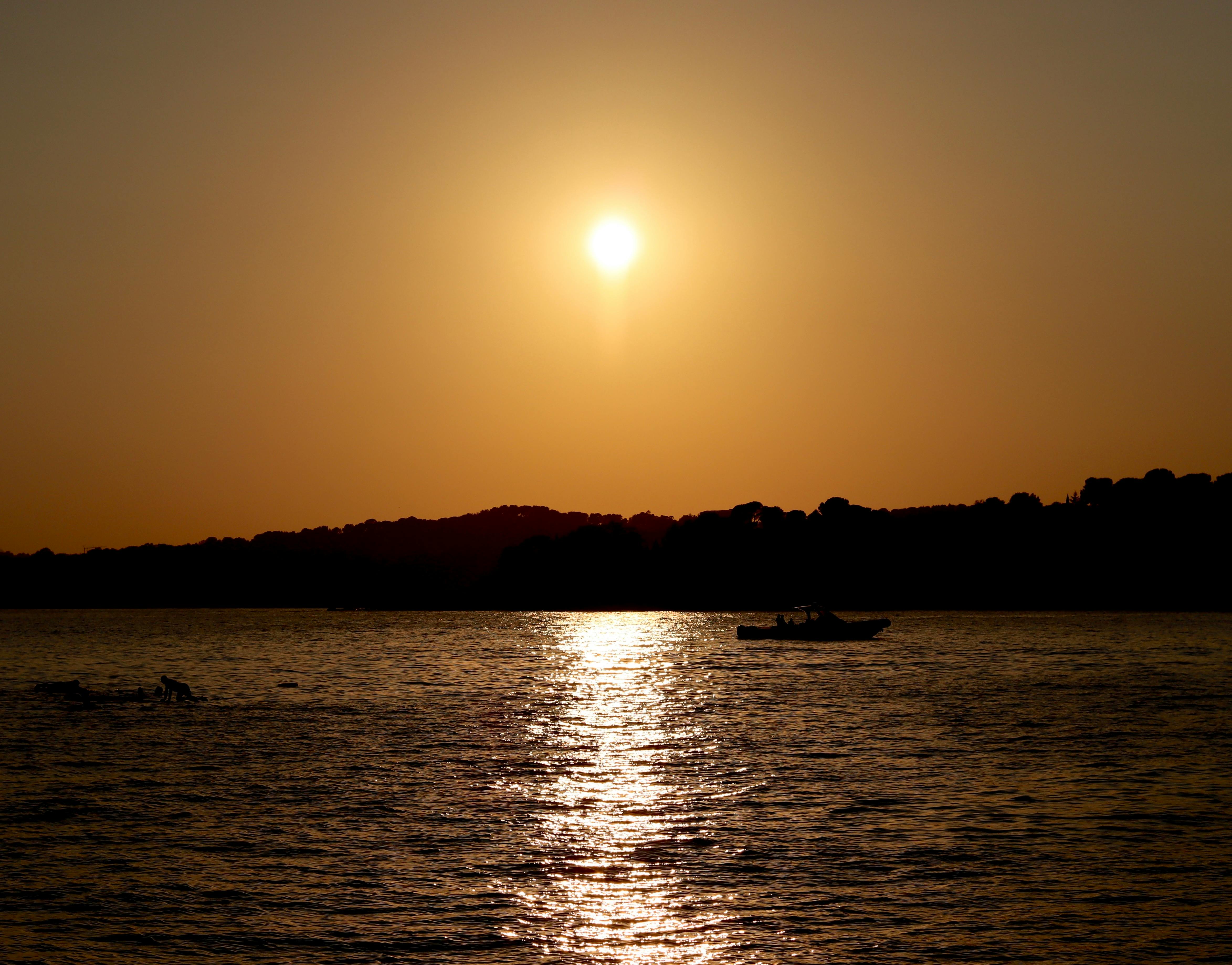 Serene Sunset Over Calm Waters Landscape · Free Stock Photo