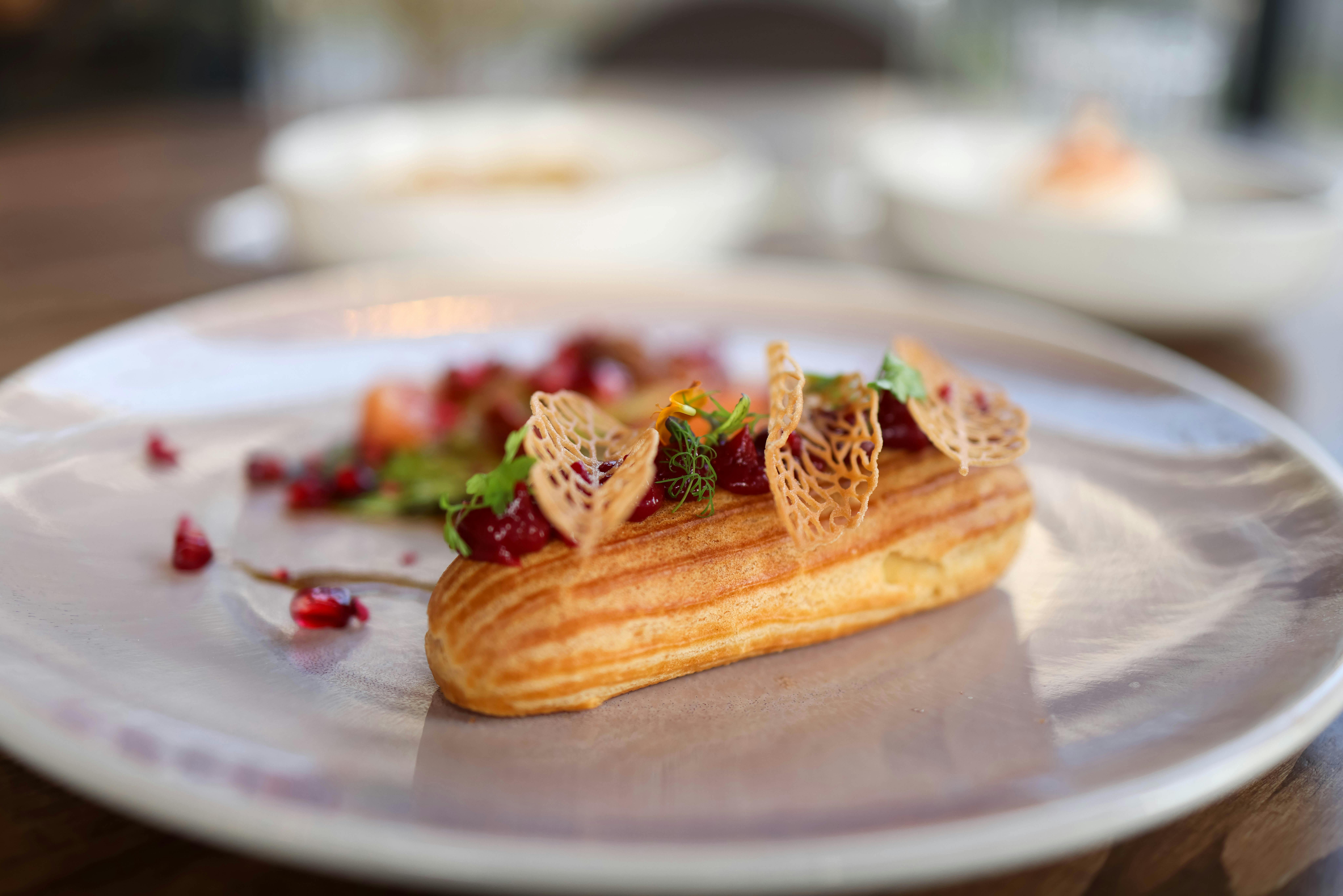 Gourmet Eclair with Artistic Plating · Free Stock Photo