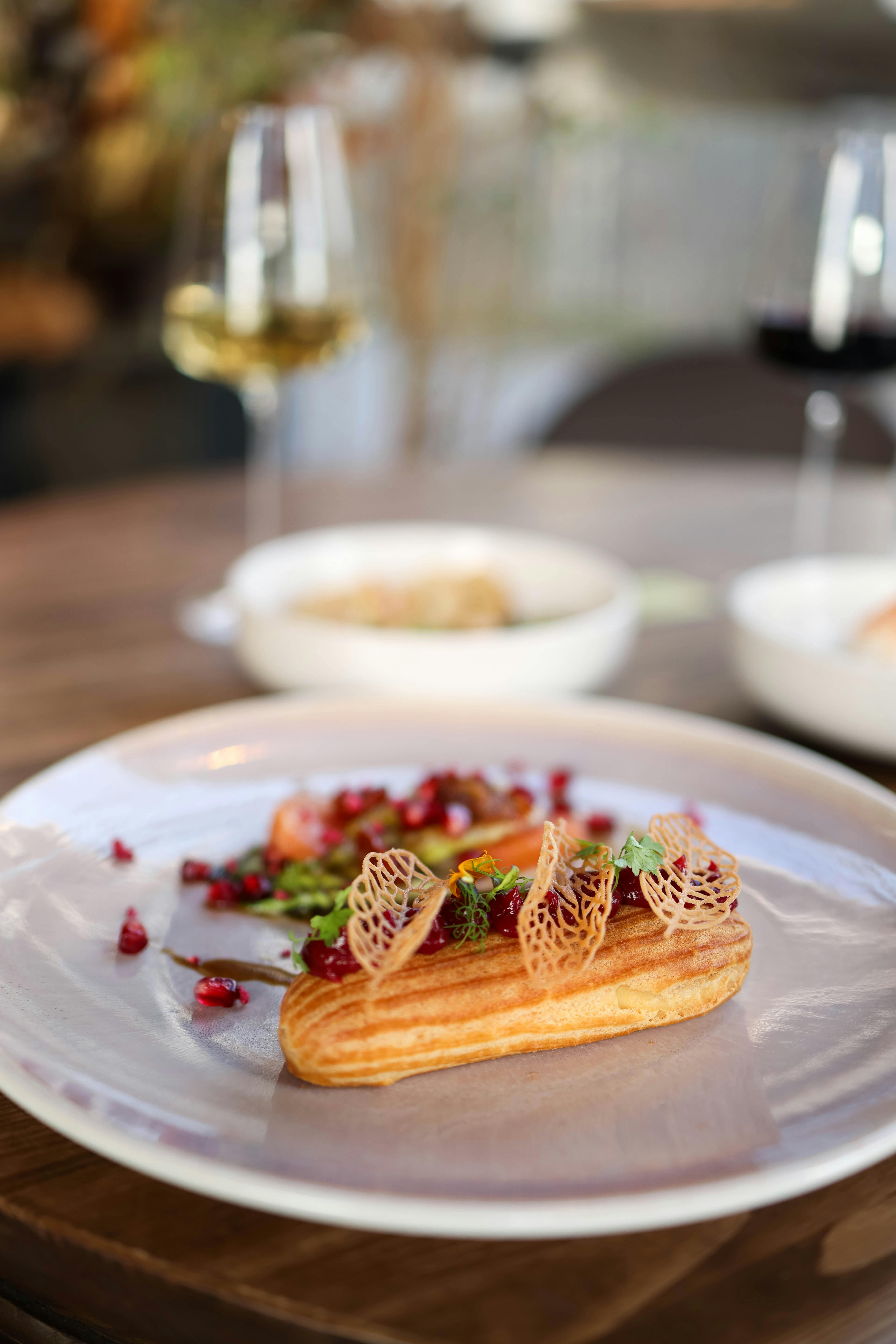 Gourmet Eclair with Elegant Garnish on Dining Table · Free Stock Photo