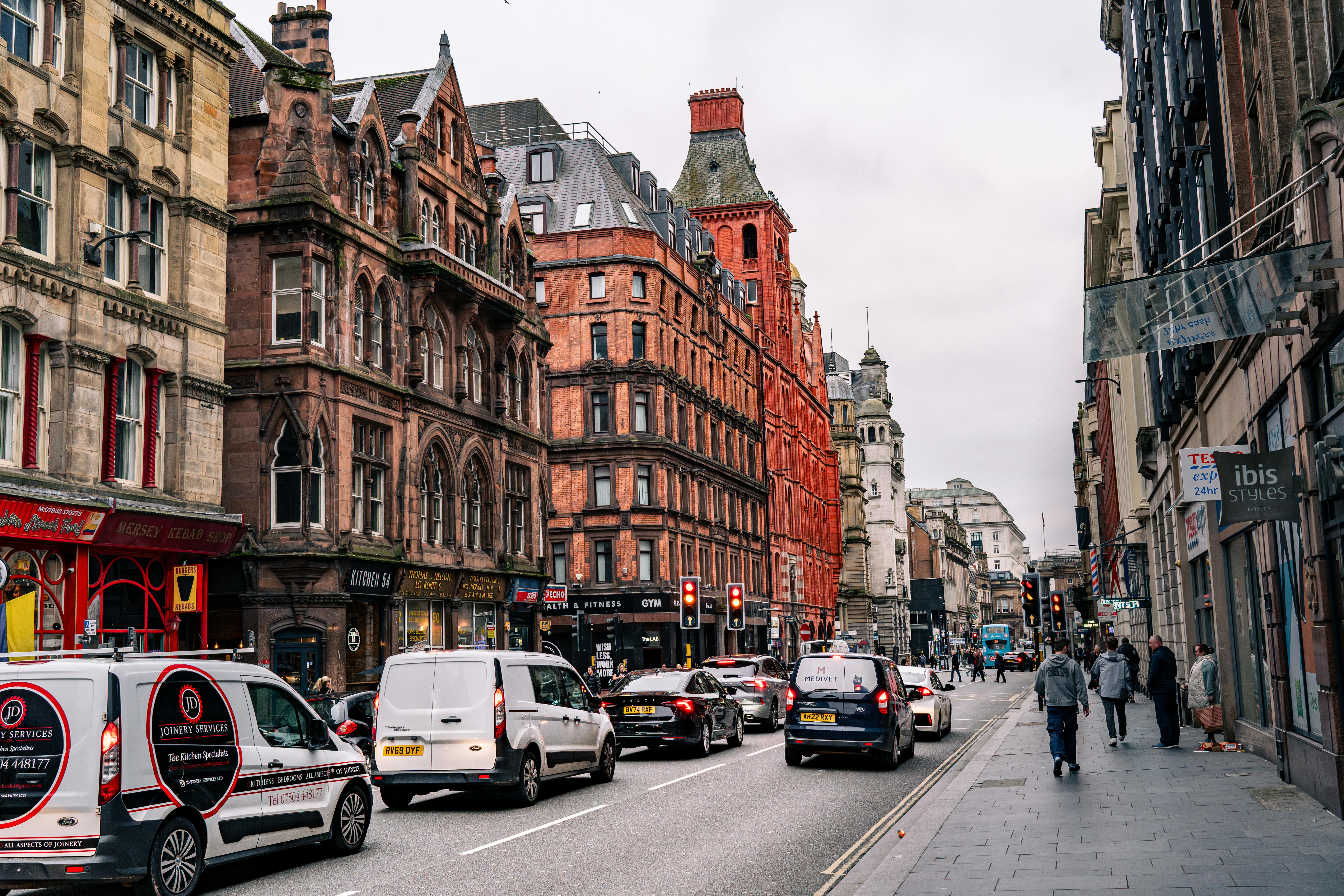 Bustling Street Scene in Historic City · Free Stock Photo
