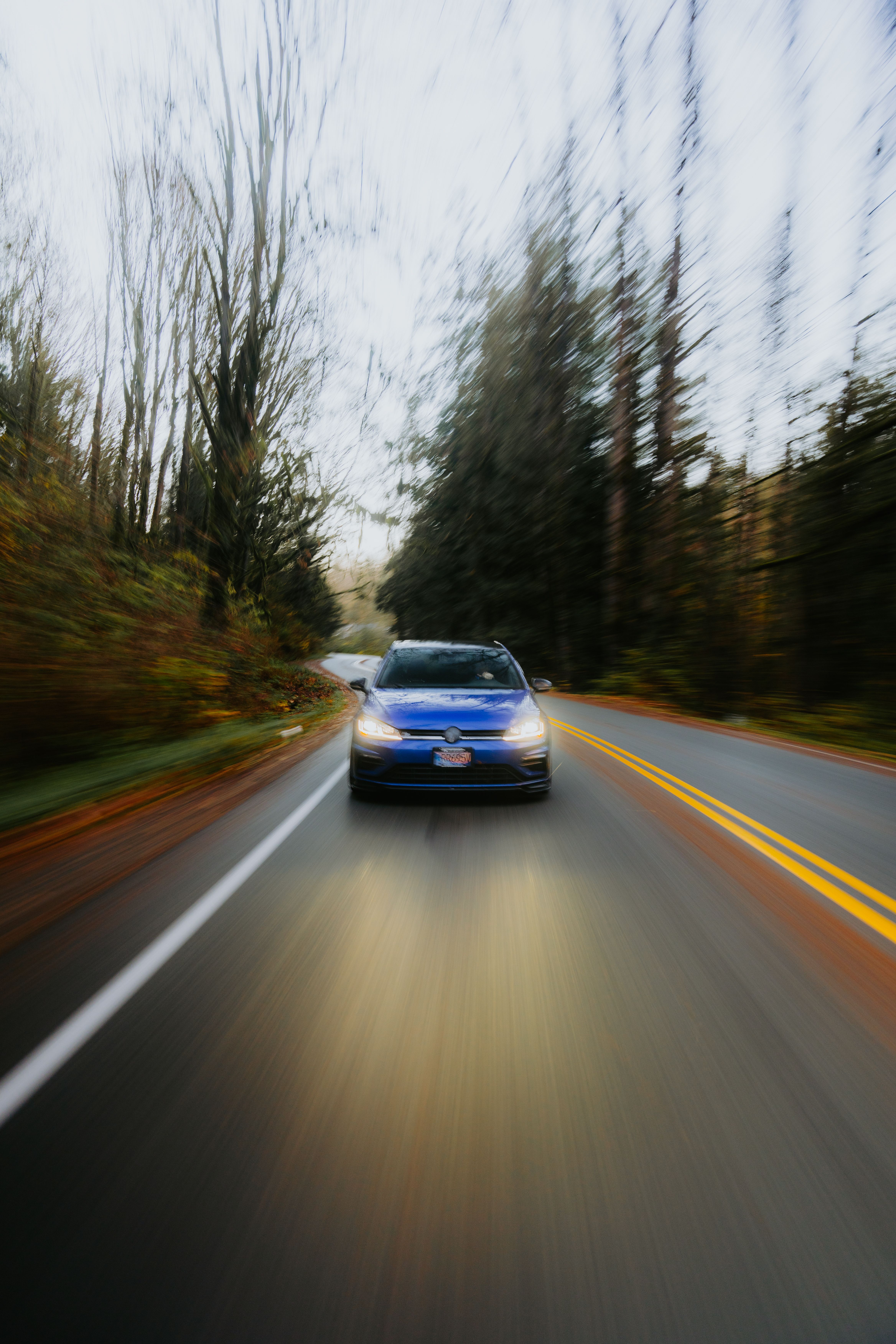 Dynamic Motion Blur of Car on Forest Road · Free Stock Photo