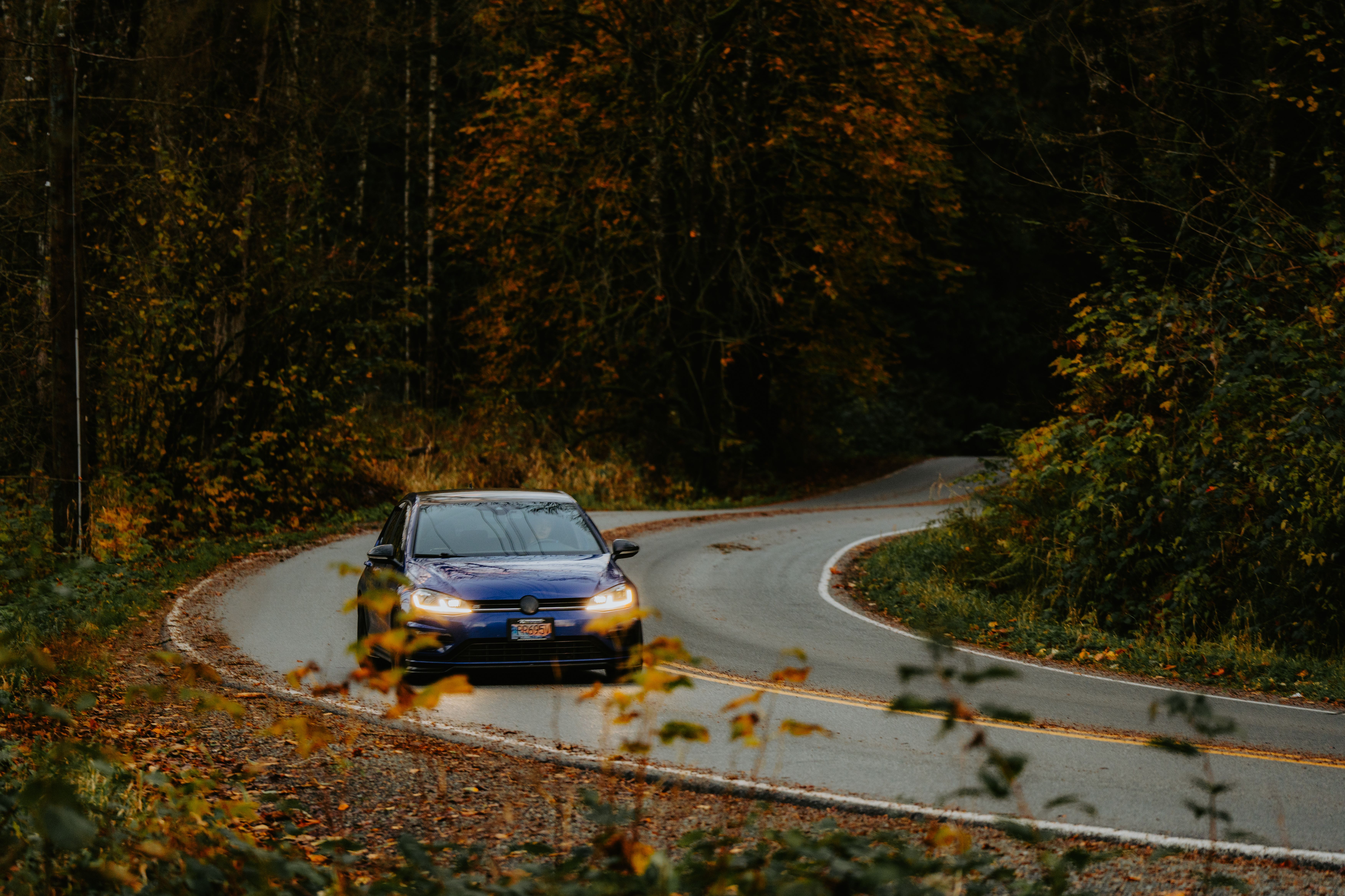 Gray Car on Long Winding Road · Free Stock Photo