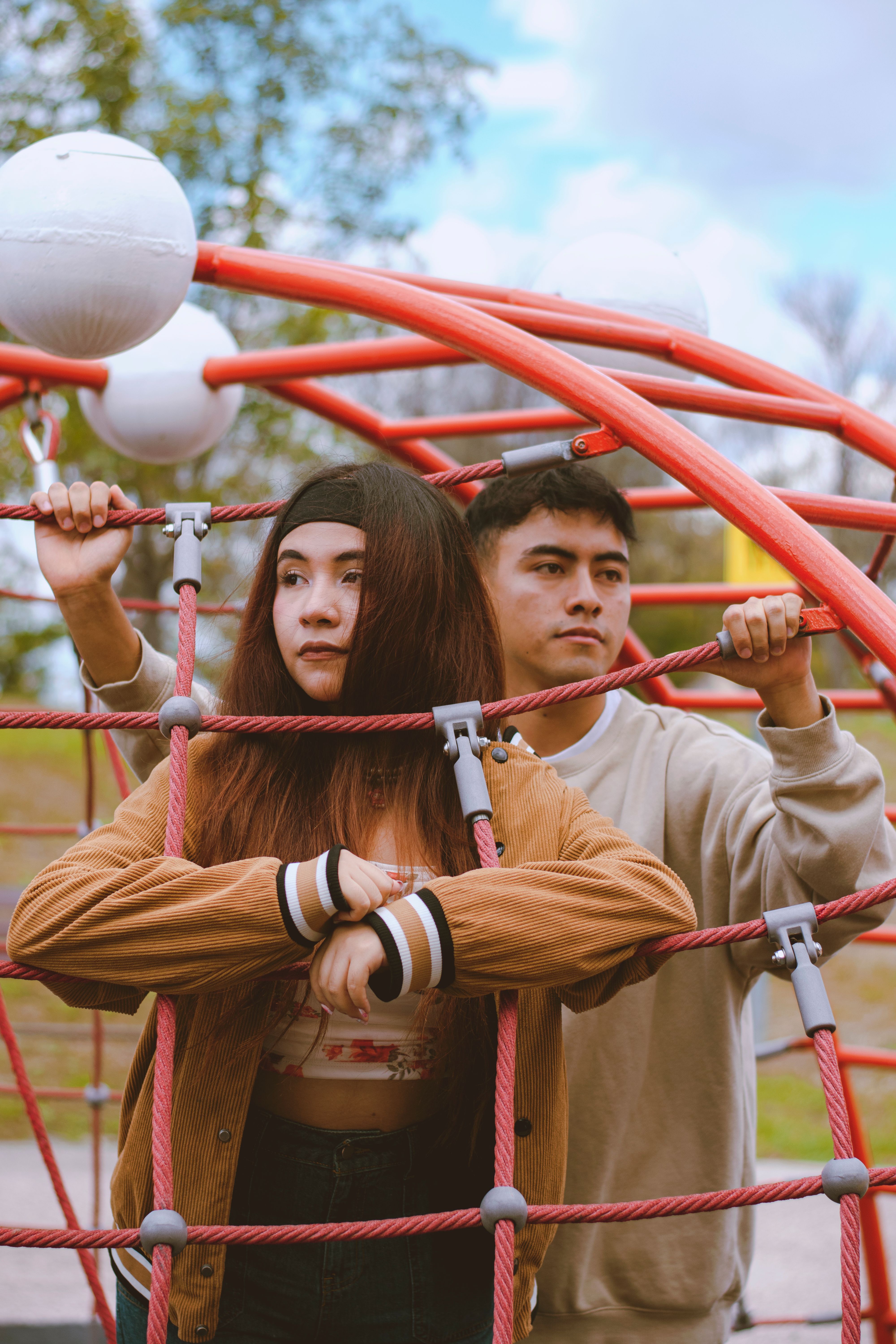 Teenagers Enjoying the Outdoors on Playground · Free Stock Photo