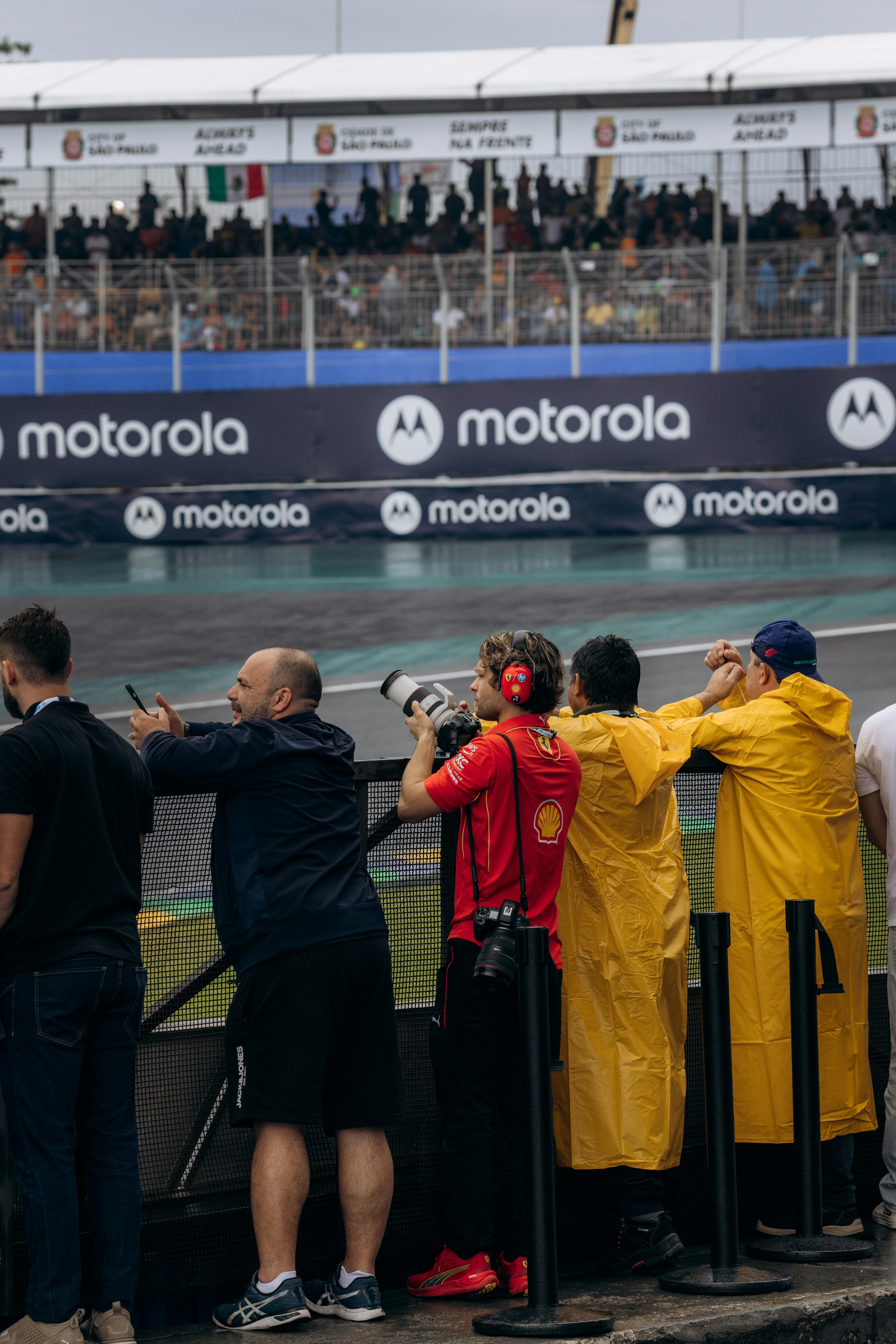 Fans Watching Formula 1 Race at Trackside · Free Stock Photo
