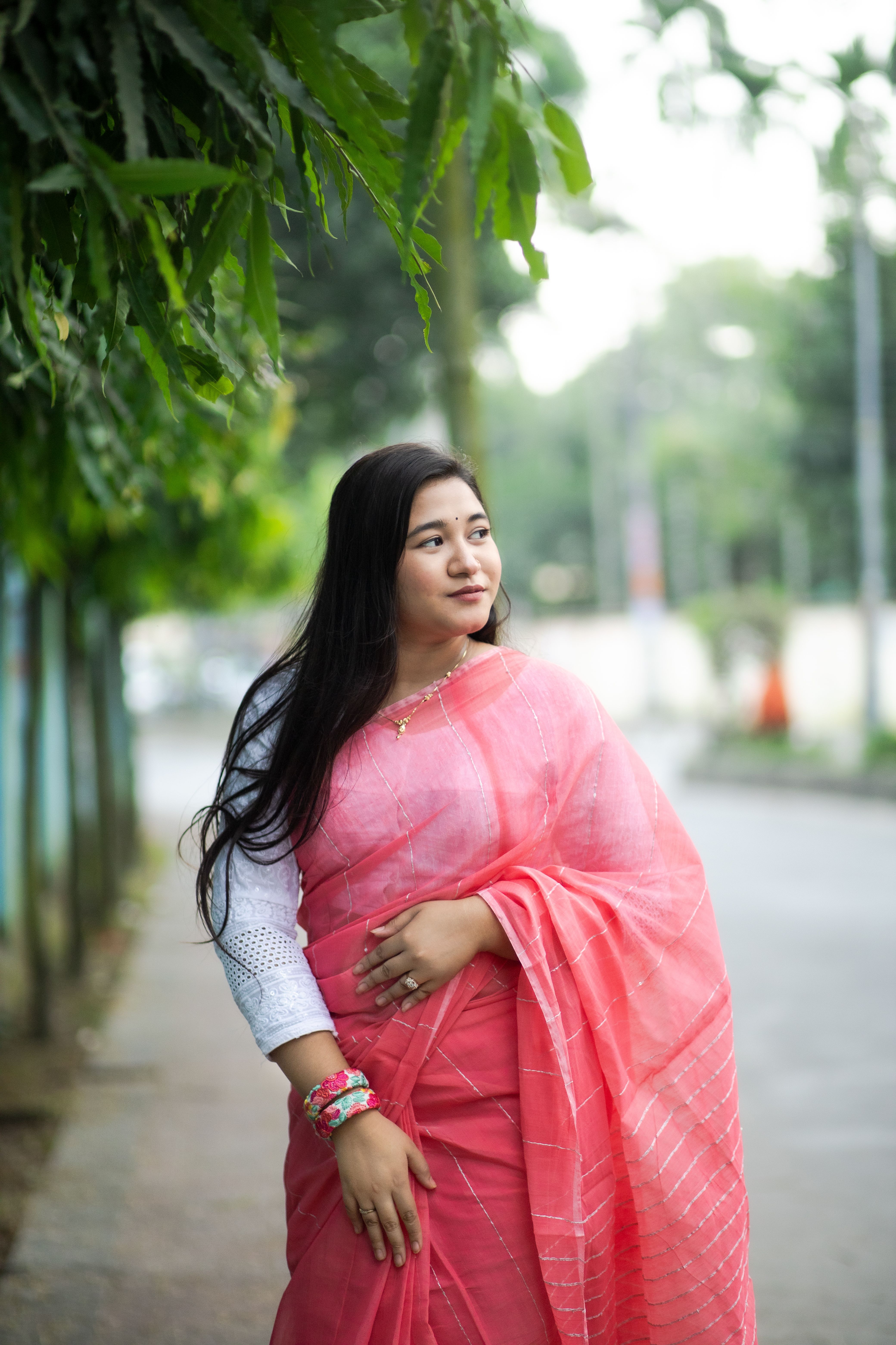 Woman in Traditional Pink Saree on a Street · Free Stock Photo