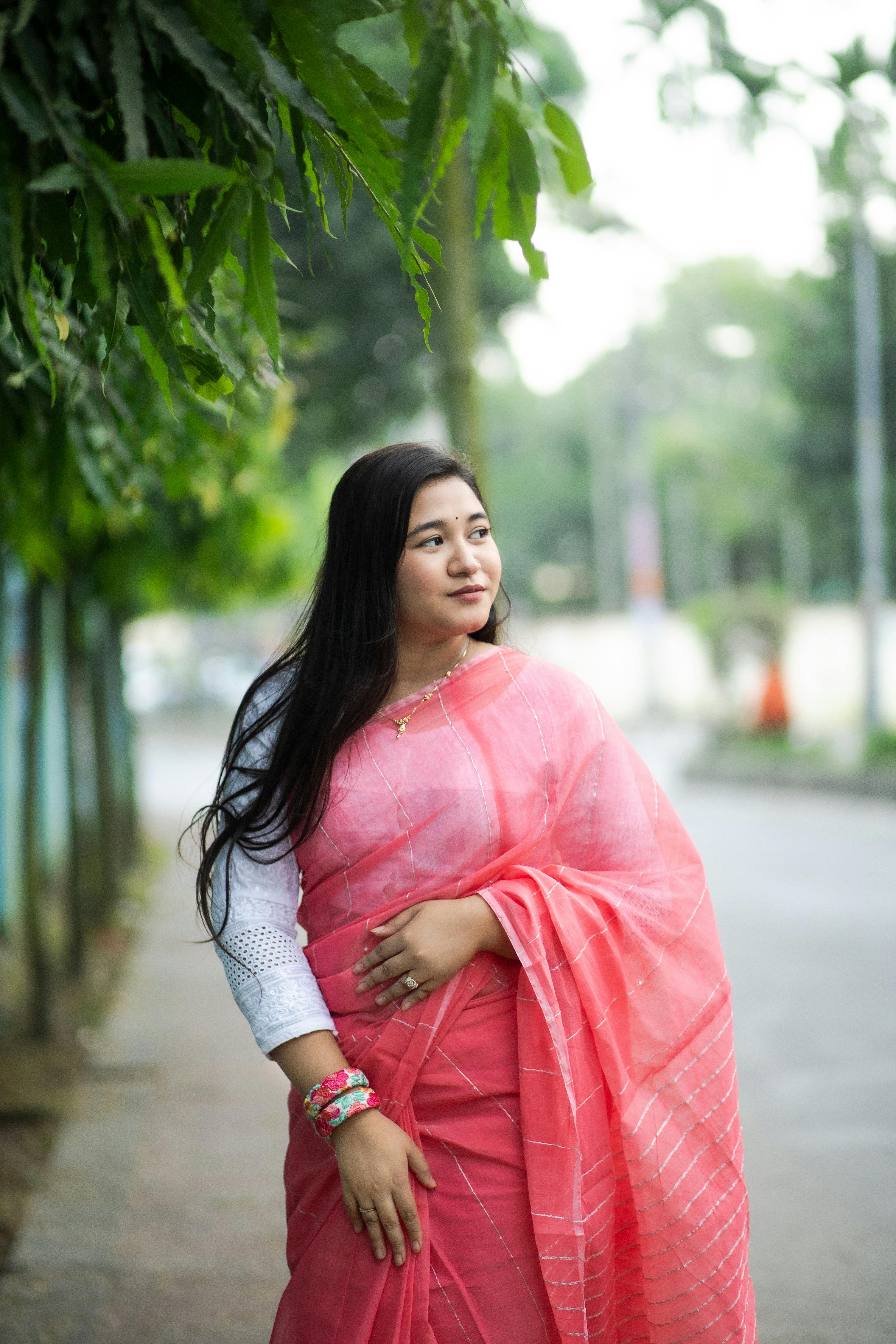 Elegant Woman in Traditional Red Sharee · Free Stock Photo