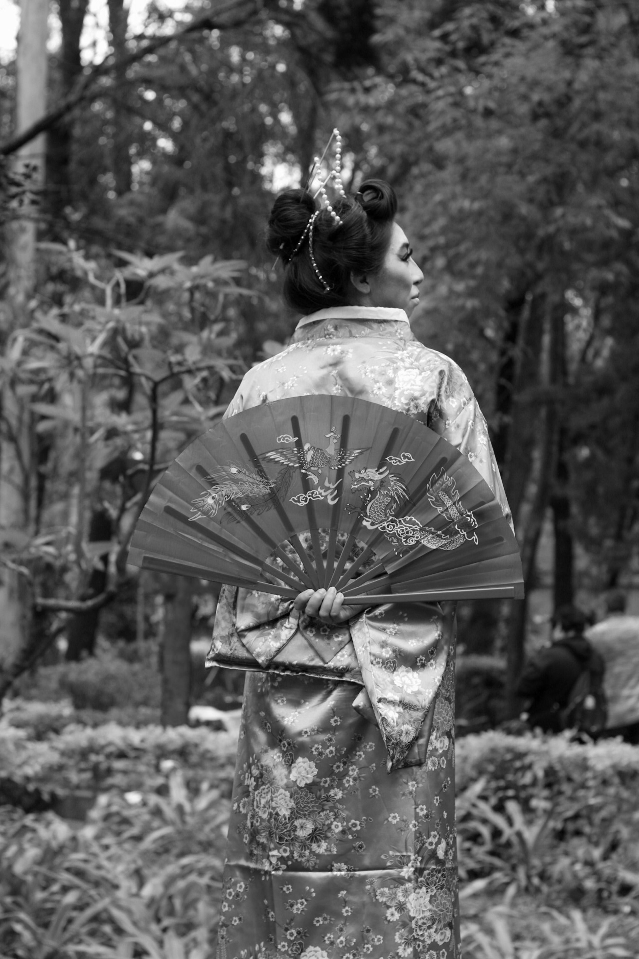 Traditional Kimono Clad Woman with Fan in Garden · Free Stock Photo