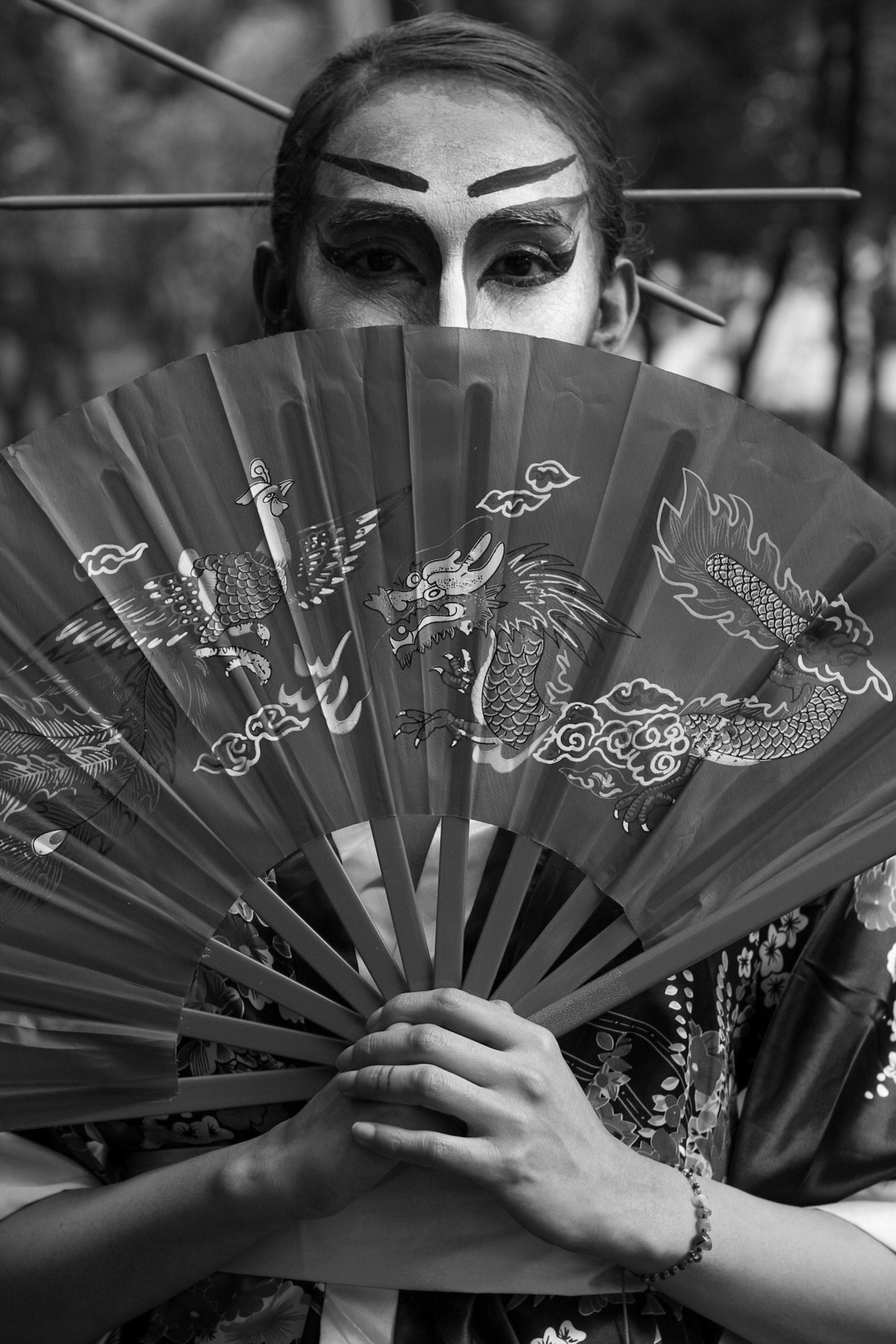 Dramatic Portrait with Decorative Fan · Free Stock Photo