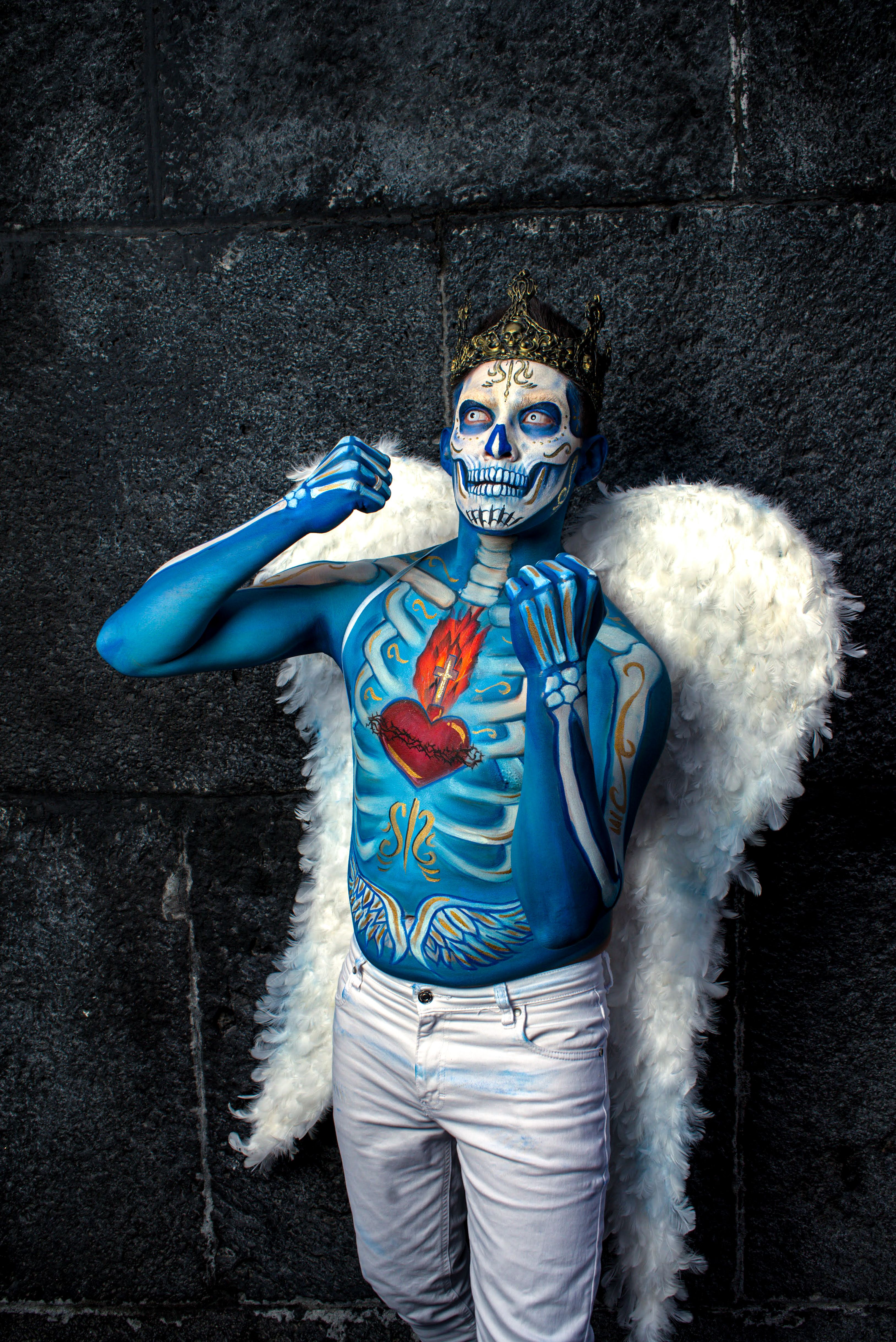 Fantasy Character with Blue Body Paint and Wings · Free Stock Photo