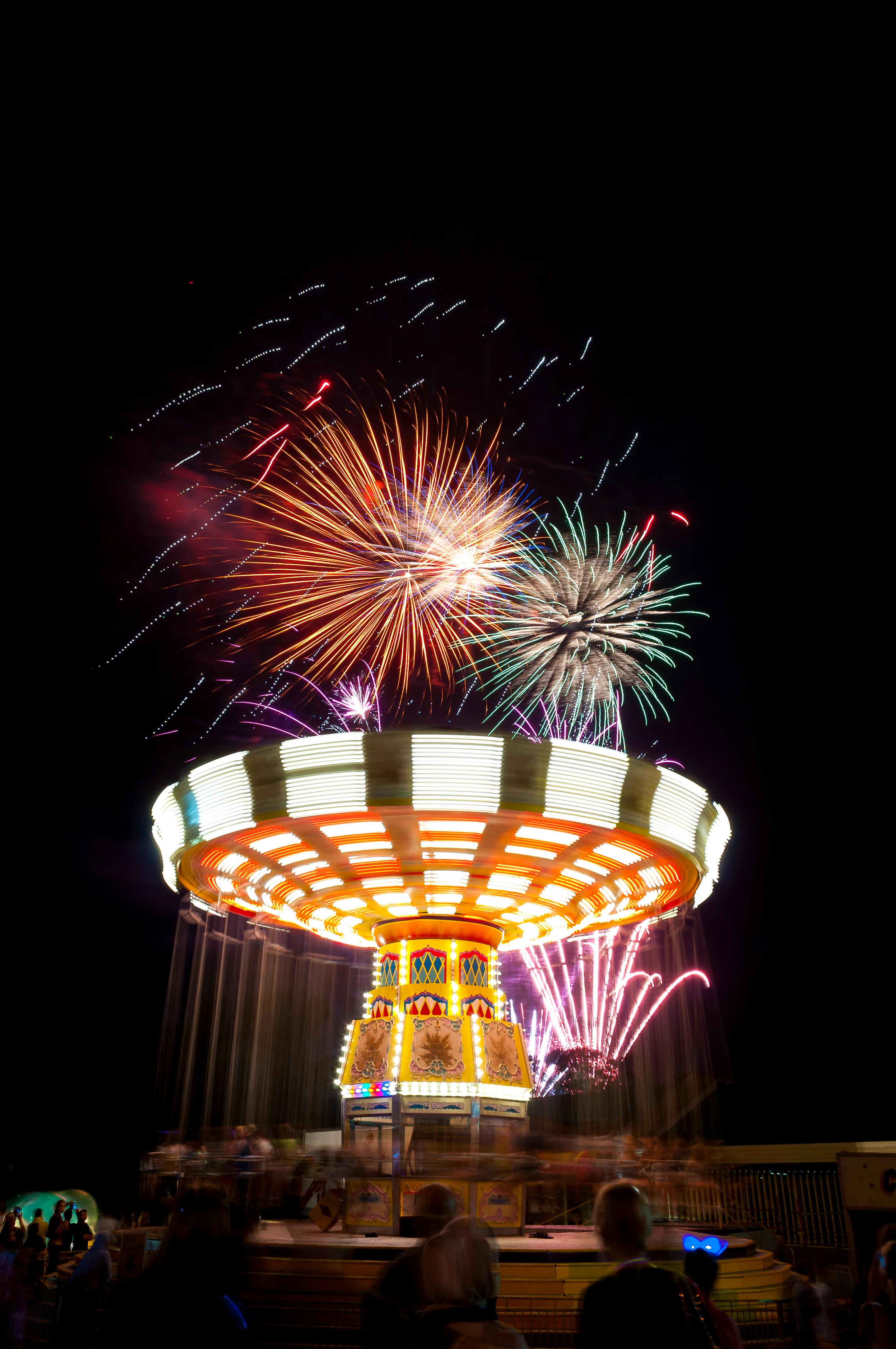 Blue and White Lights on Carnival Ride during Night Time · Free Stock Photo