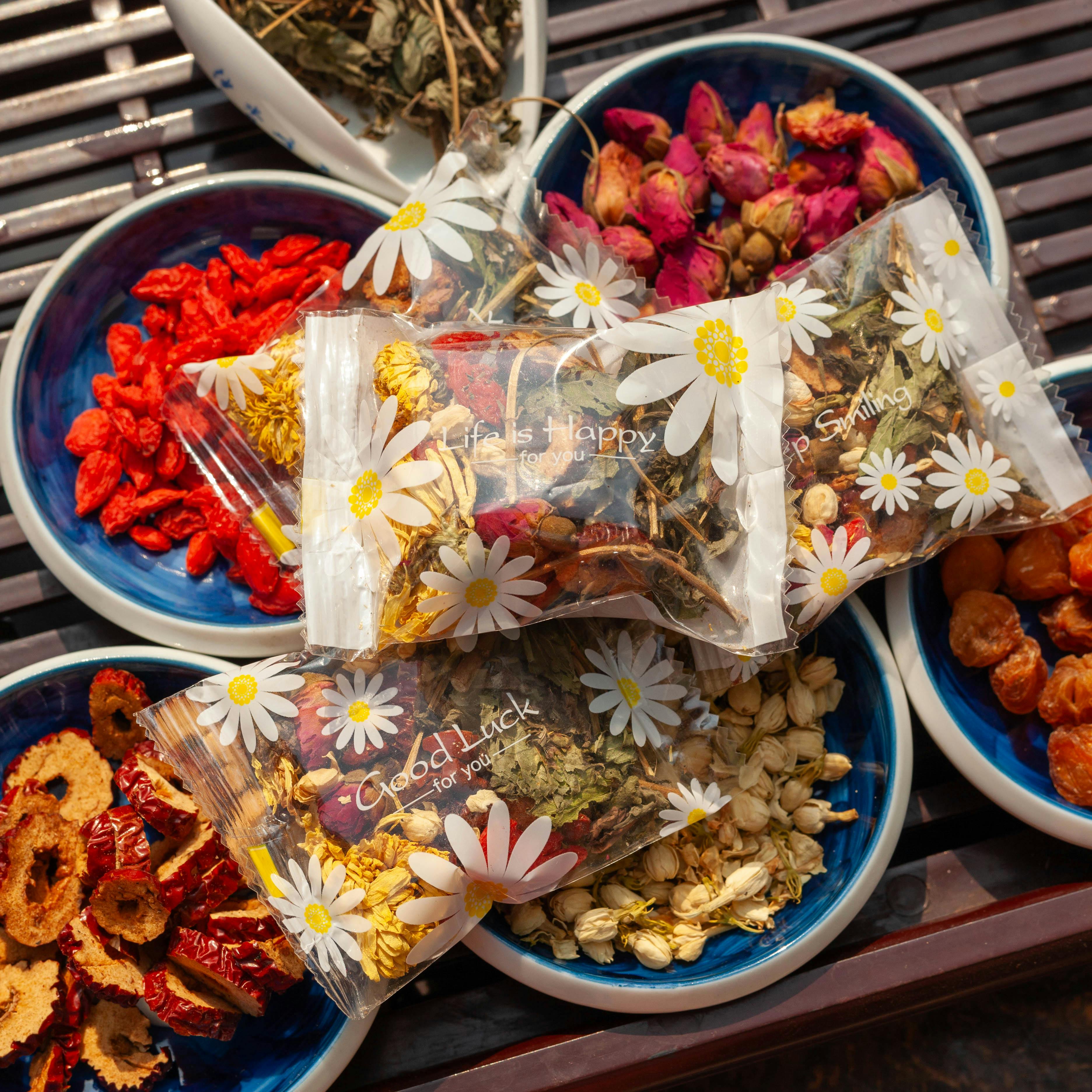 Colorful Assortment of Herbal Teas in Bowls · Free Stock Photo