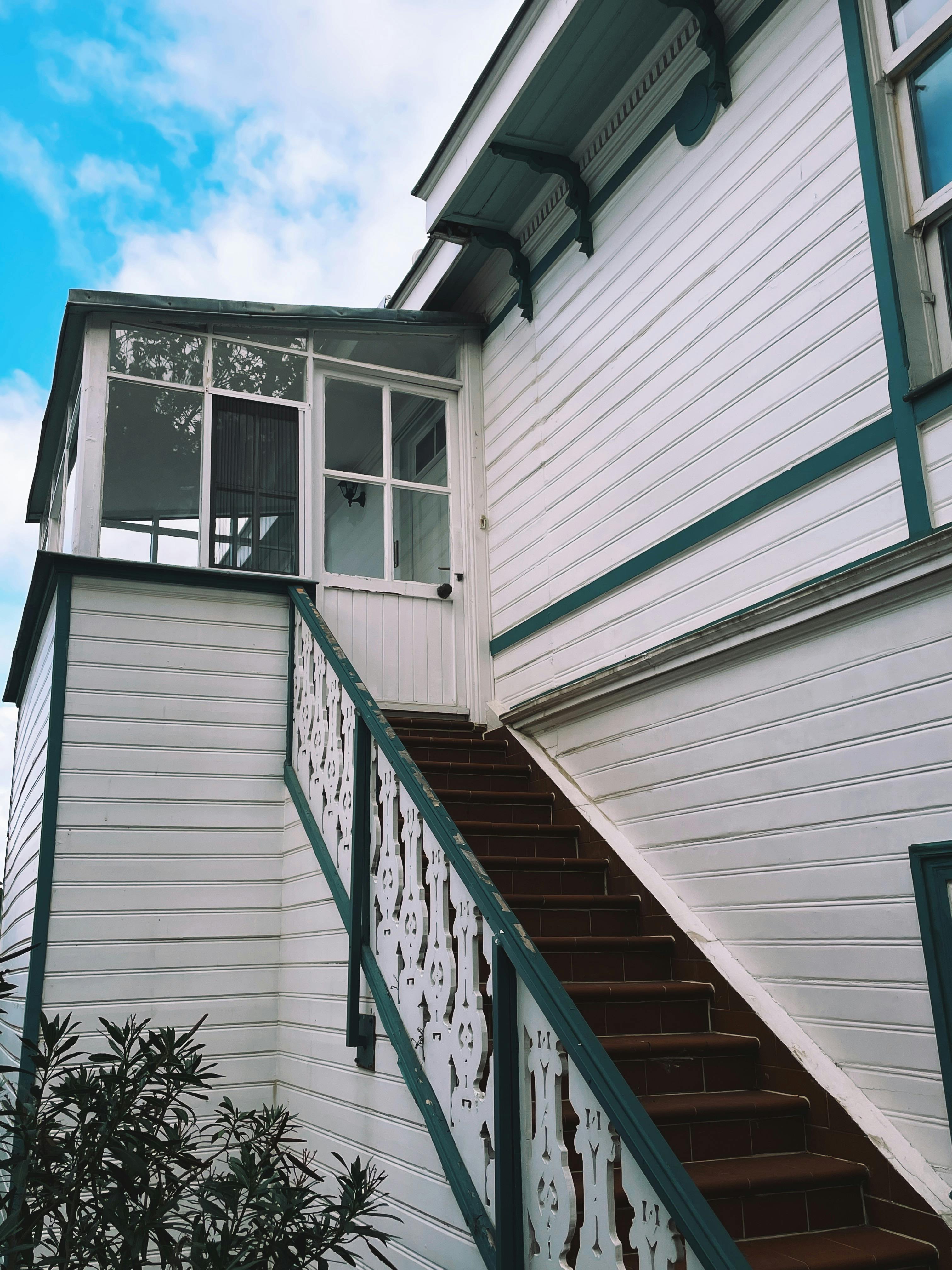 Rustic Wooden Staircase Leading to Veranda · Free Stock Photo
