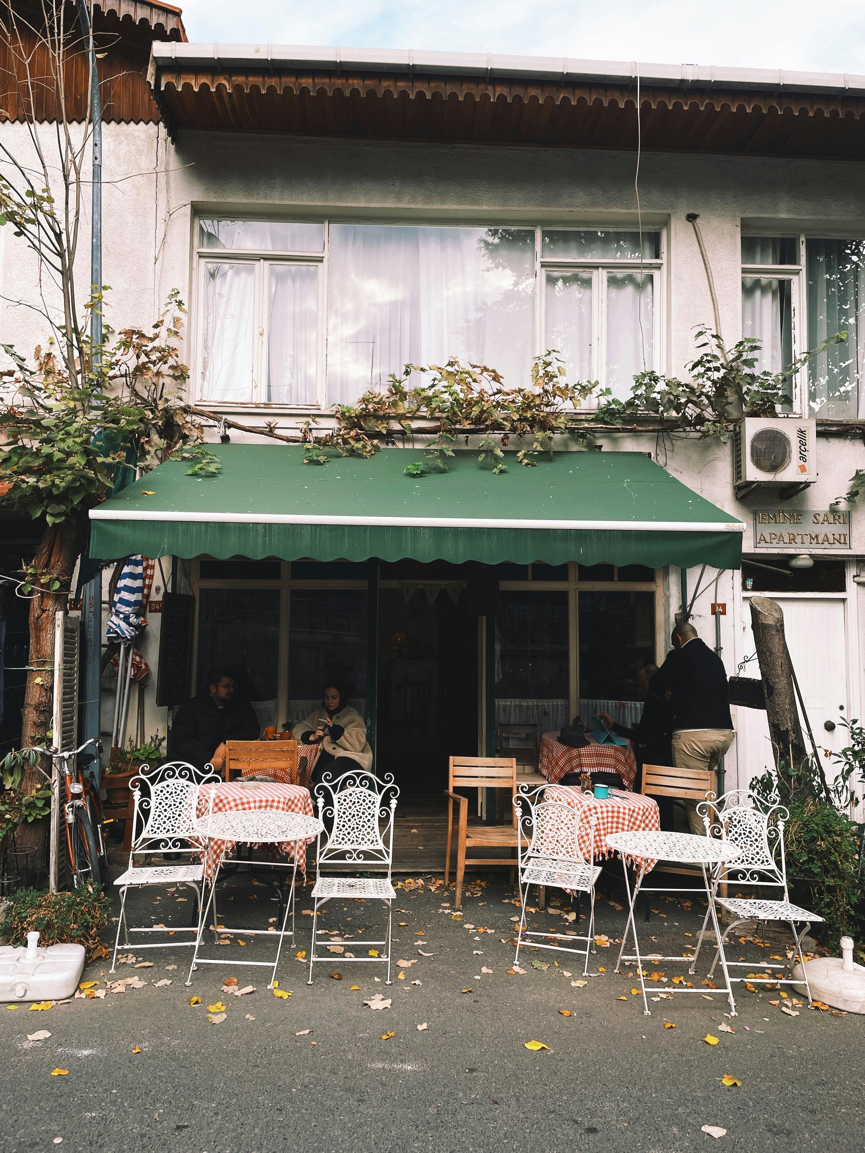 Cozy Outdoor Café Seating in Urban Setting · Free Stock Photo