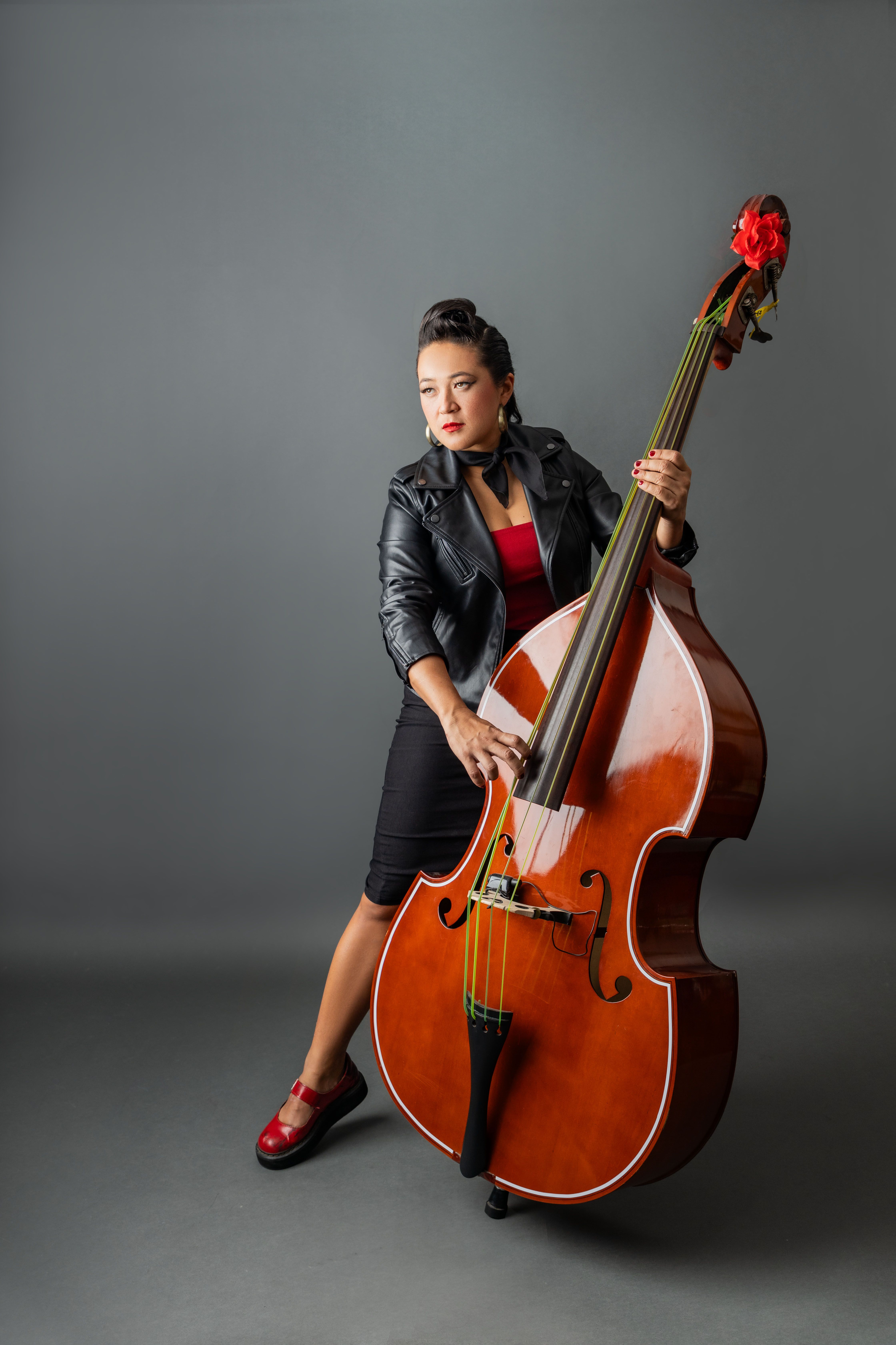 Woman Playing Double Bass in Studio Portrait · Free Stock Photo