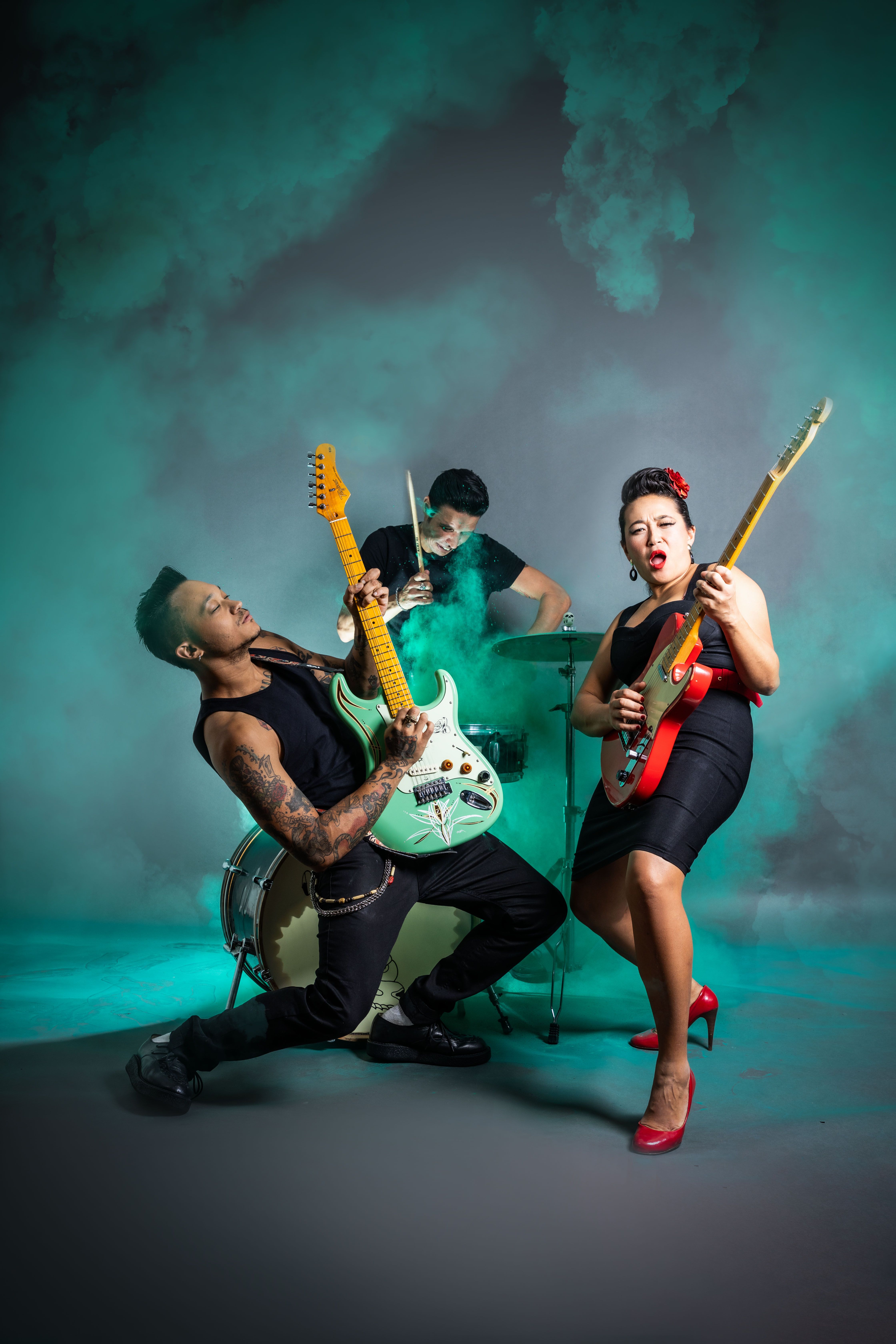 Dynamic band performance with electric guitars · Free Stock Photo
