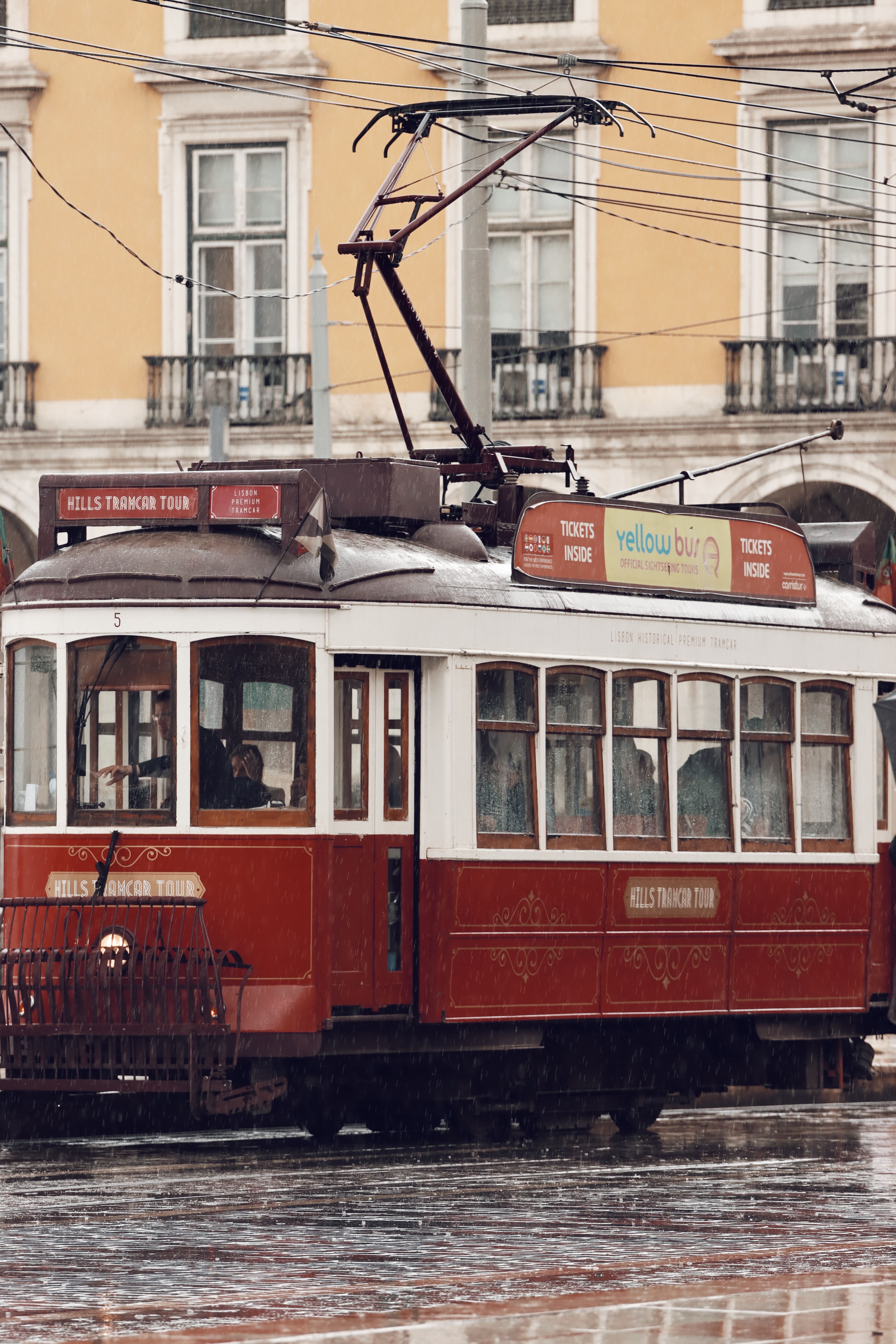 Classic Red Tram in Lisbon on a Rainy Day · Free Stock Photo