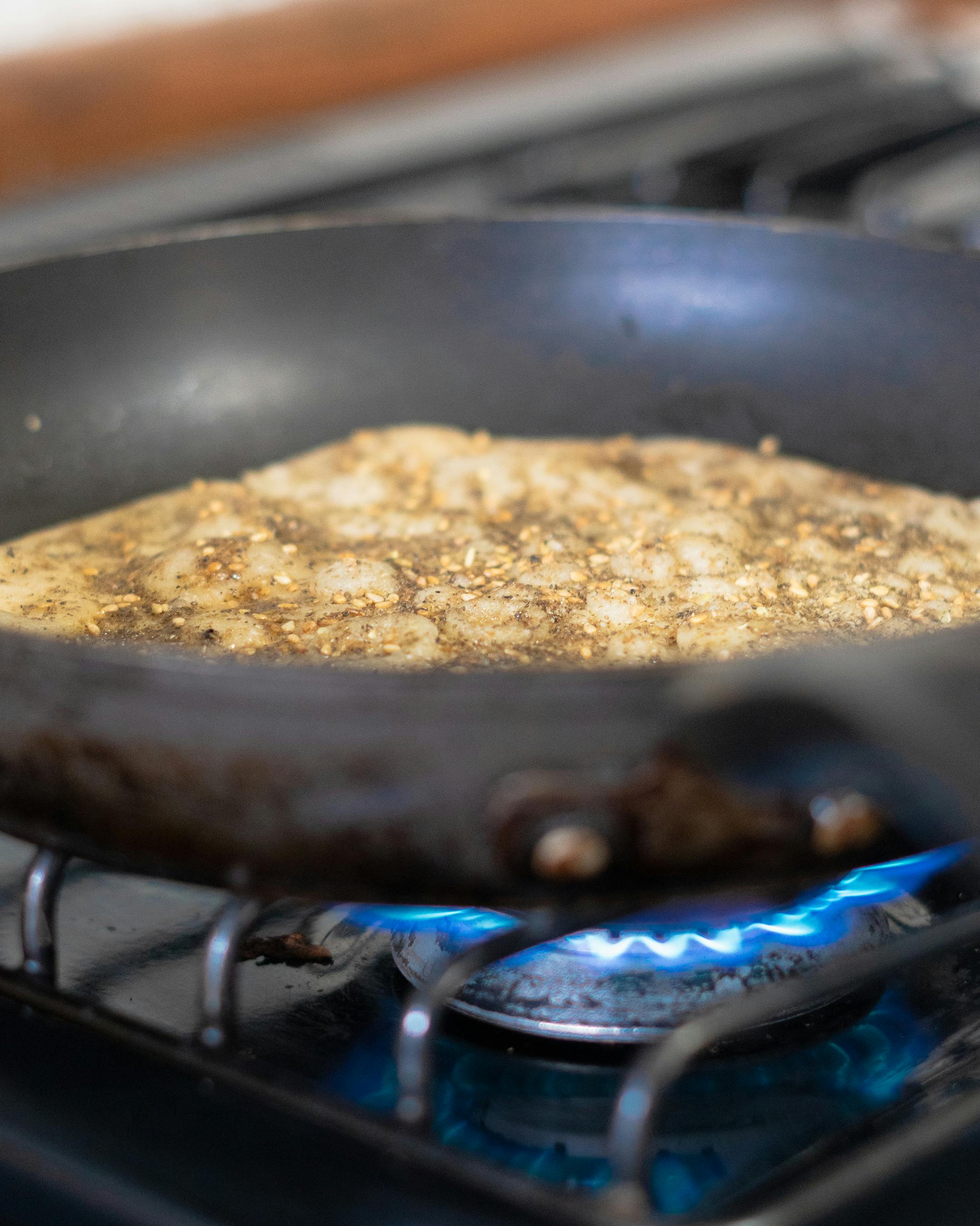 Lebanese Saj Bread Cooking on Stove · Free Stock Photo