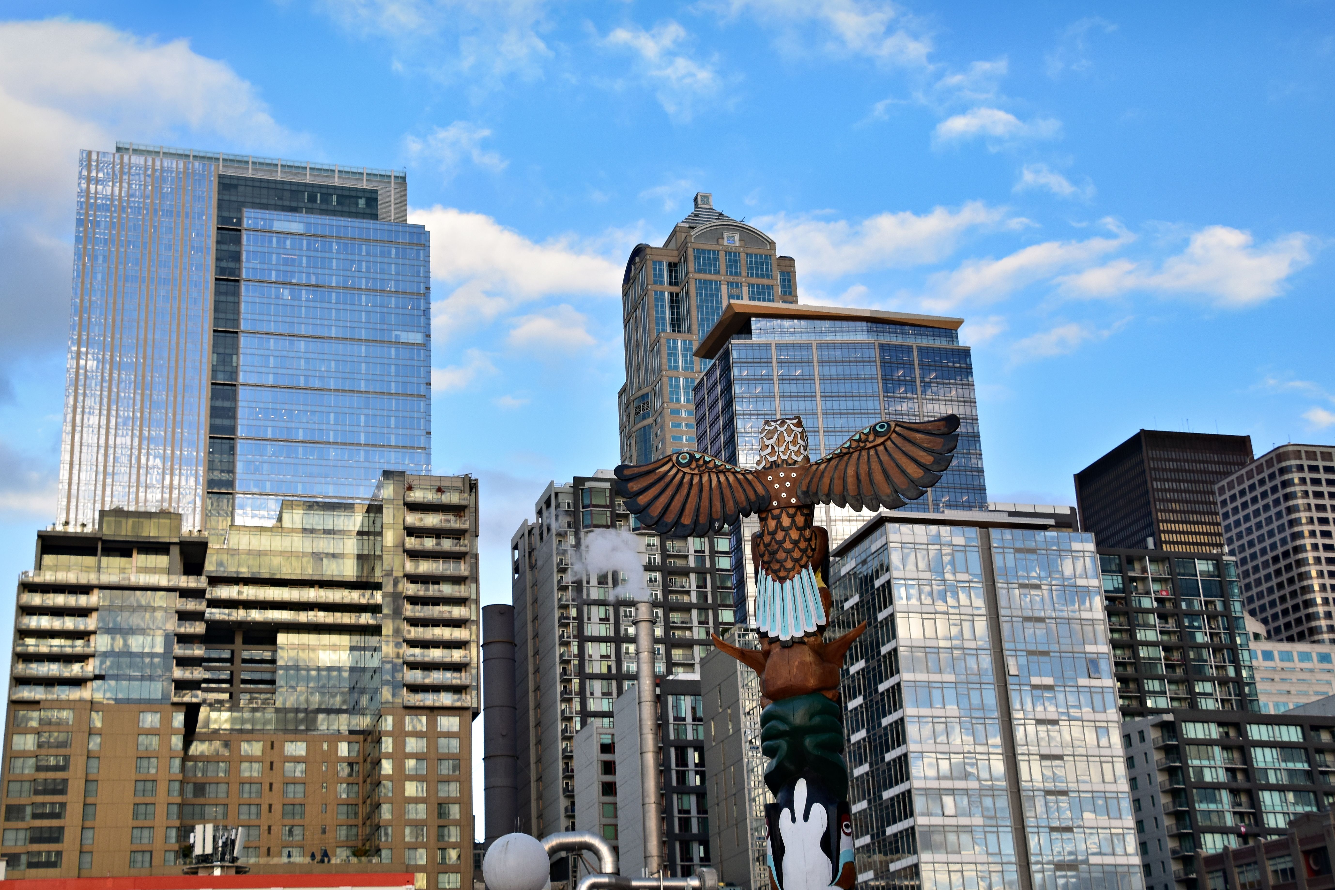 Seattle Skyline with Iconic Totem Pole · Free Stock Photo