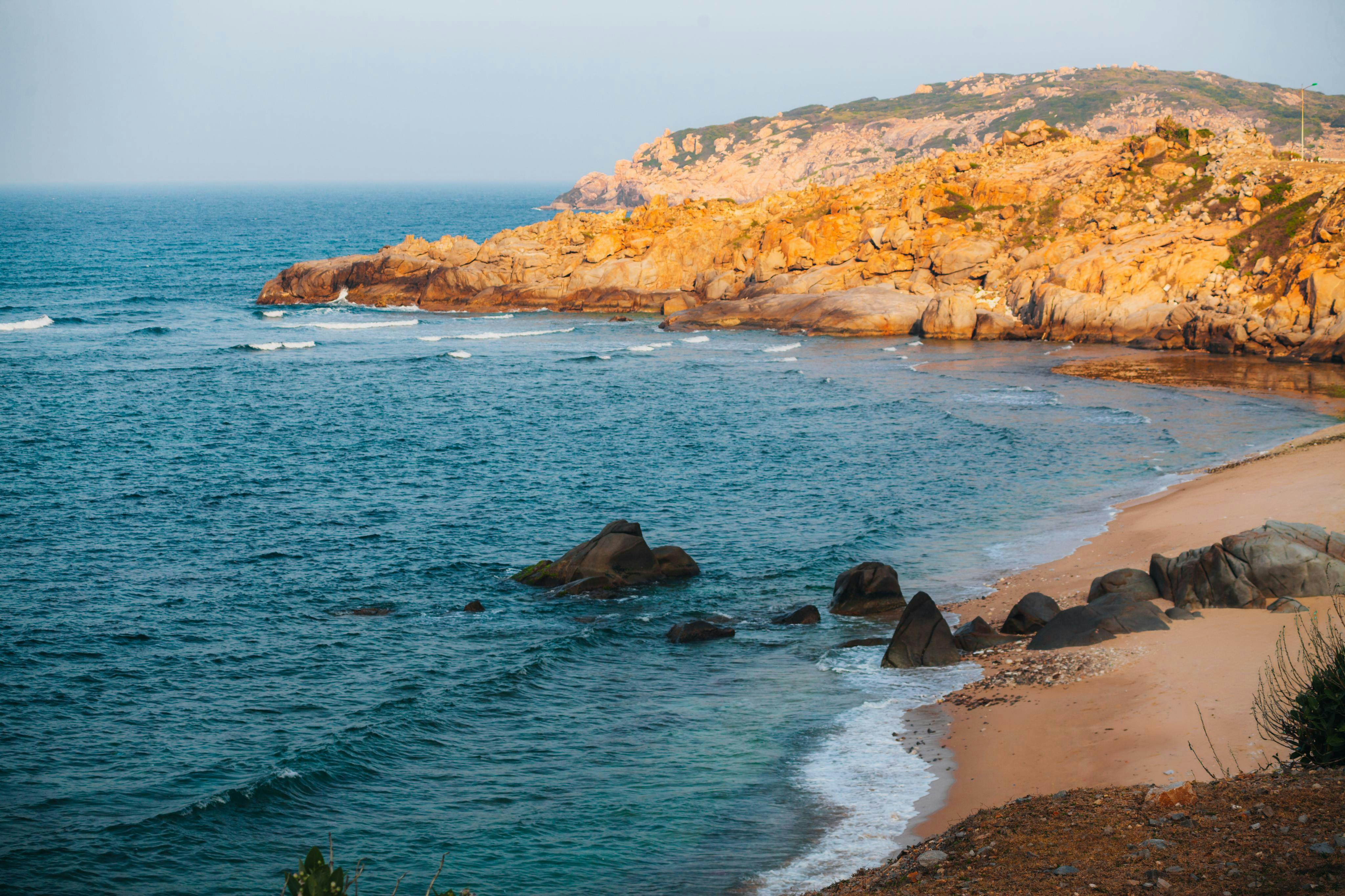 Rocky Coastal Beach at Sunset · Free Stock Photo