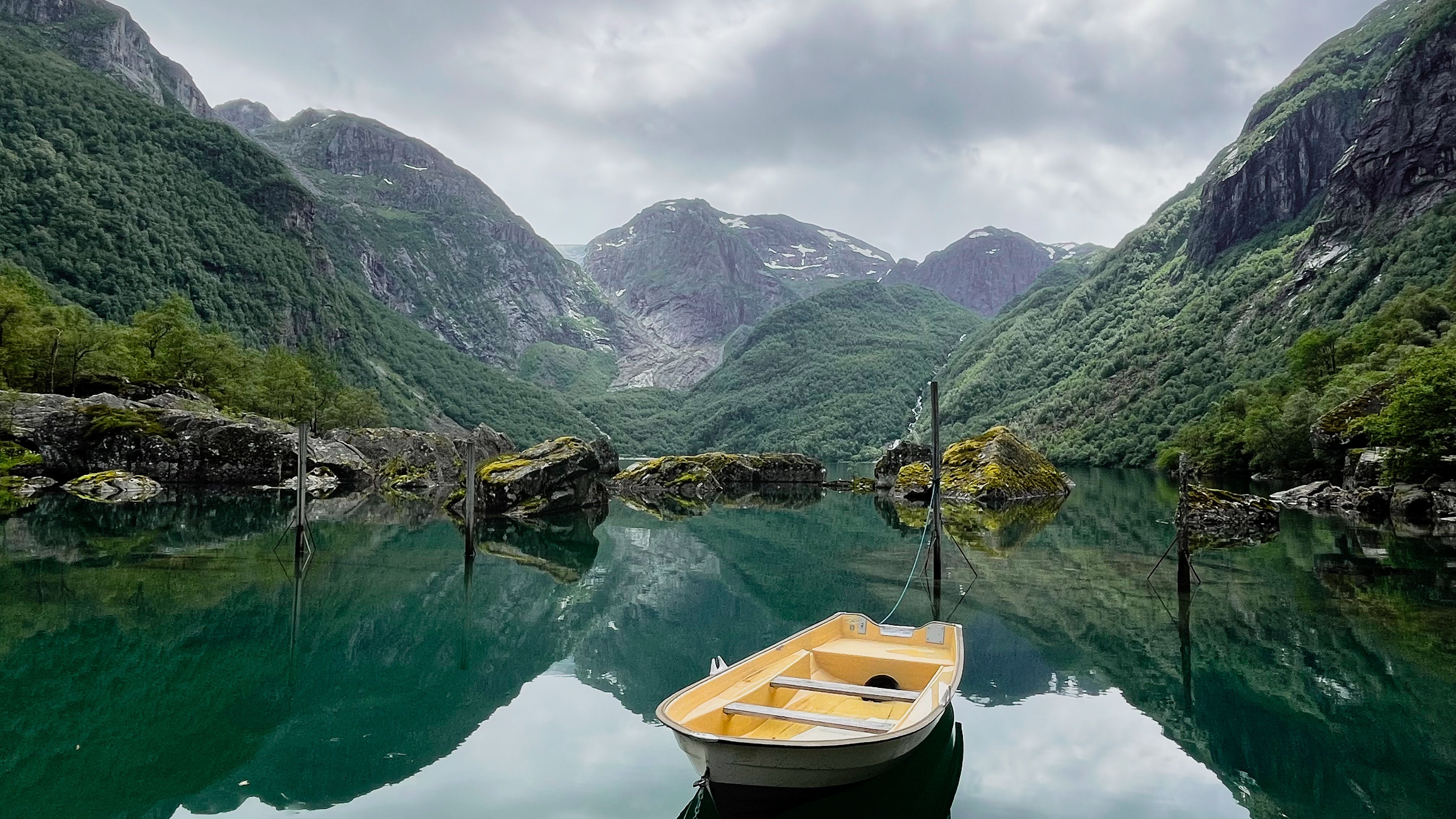 Scenic Norwegian Fjord with Reflection and Boat · Free Stock Photo
