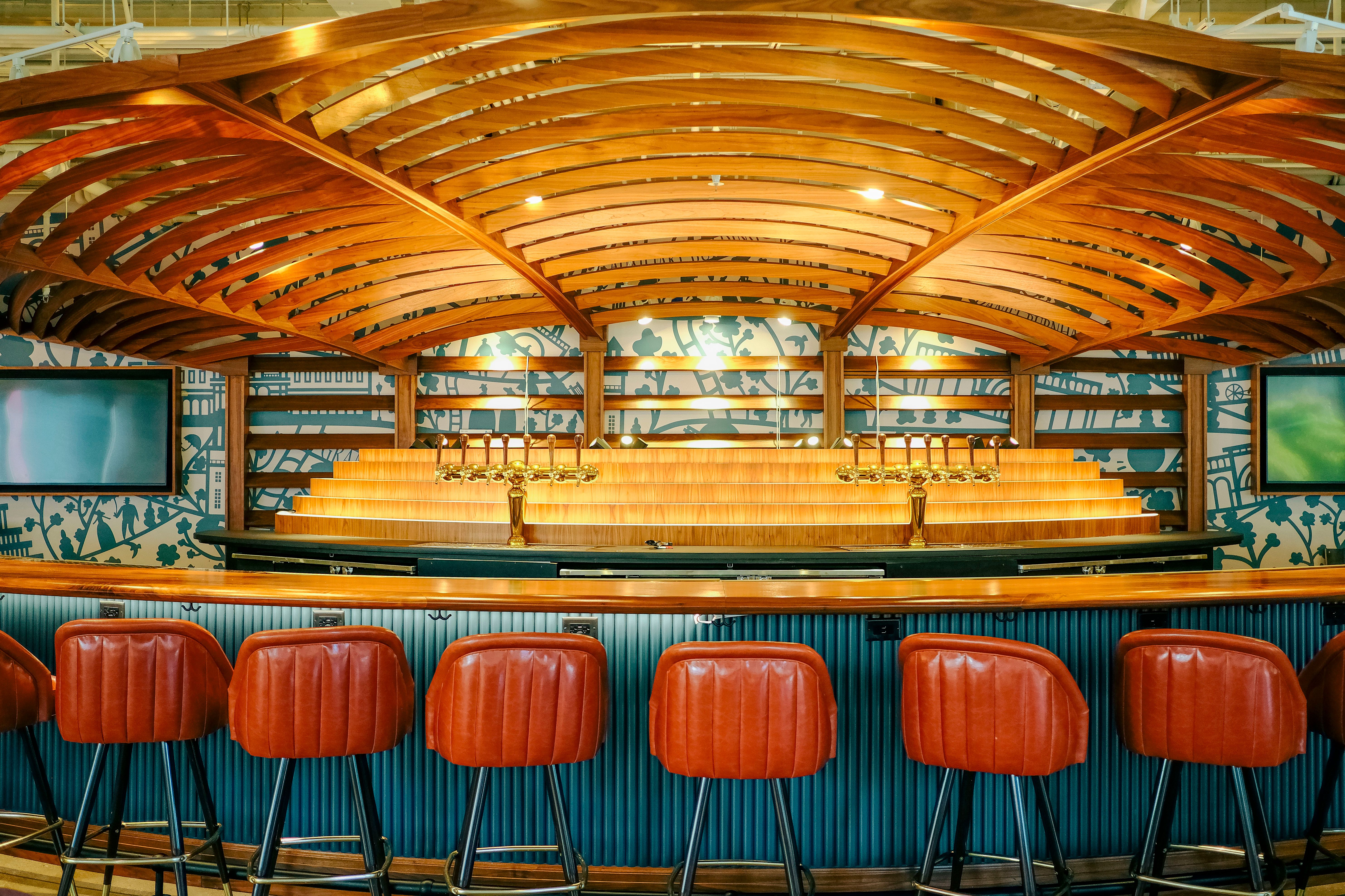 Elegant Wooden Bar Interior with Leather Seats · Free Stock Photo