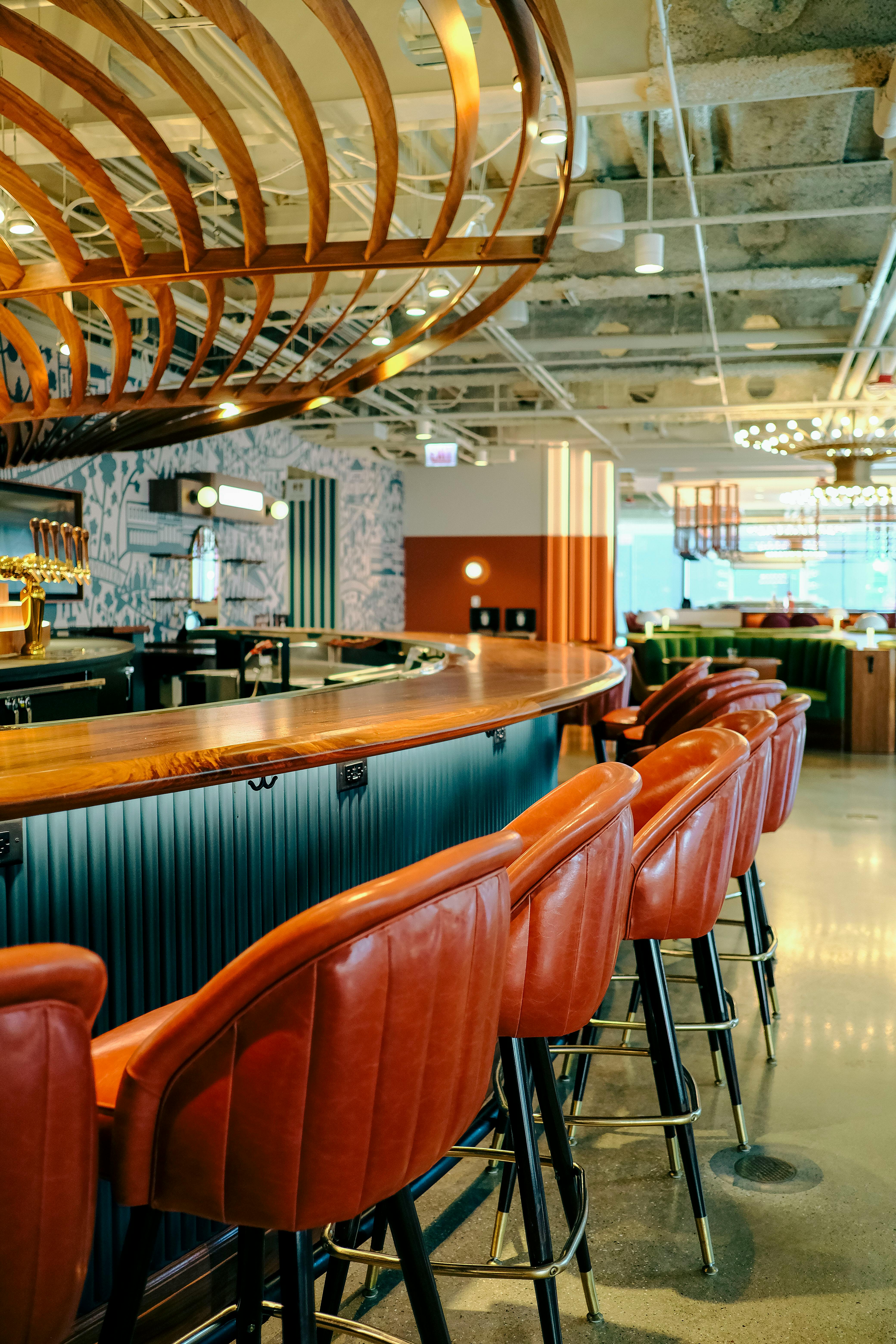 Modern Bar Interior with Stylish Seating · Free Stock Photo