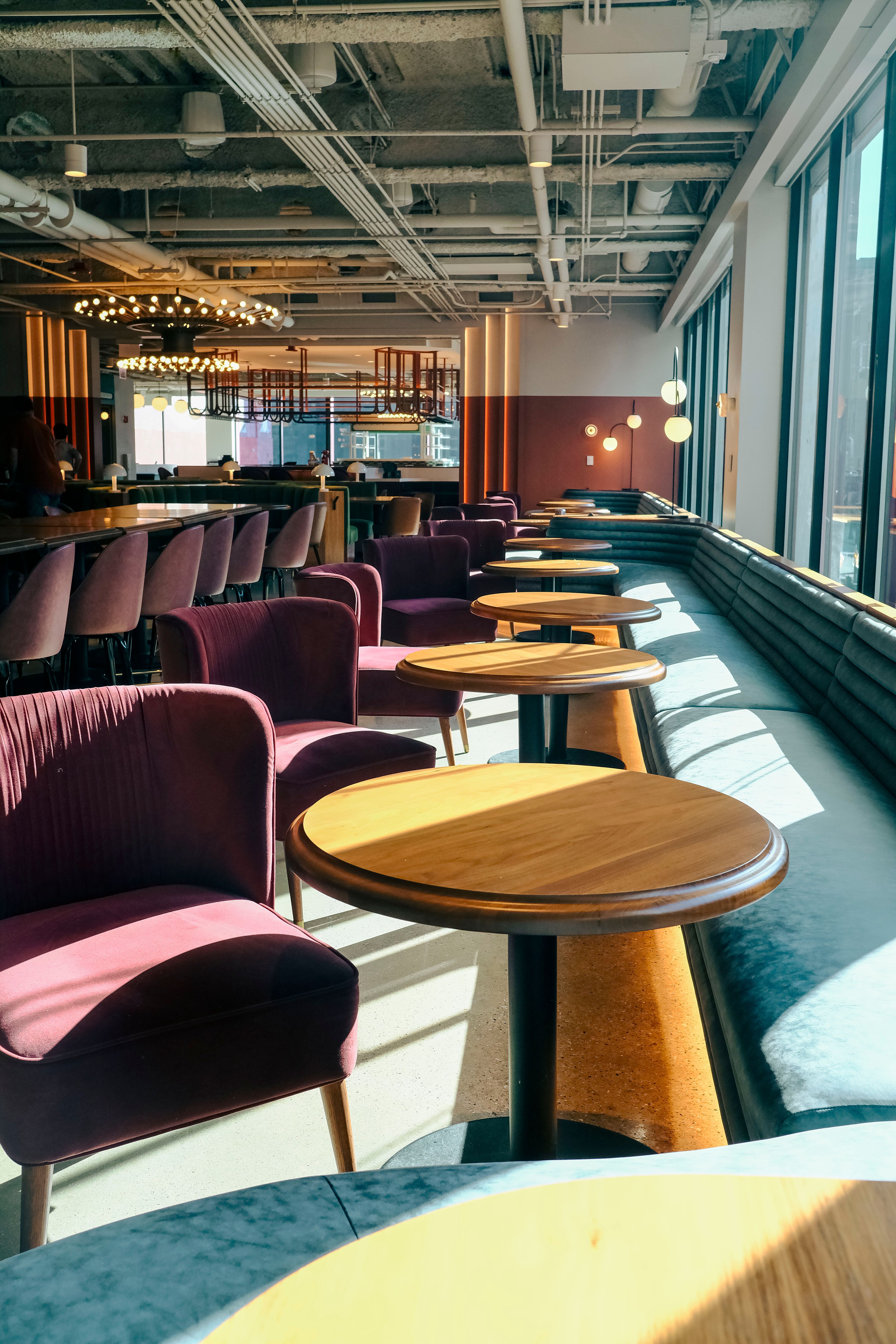 Stylish Modern Cafe Interior with Sunlight · Free Stock Photo