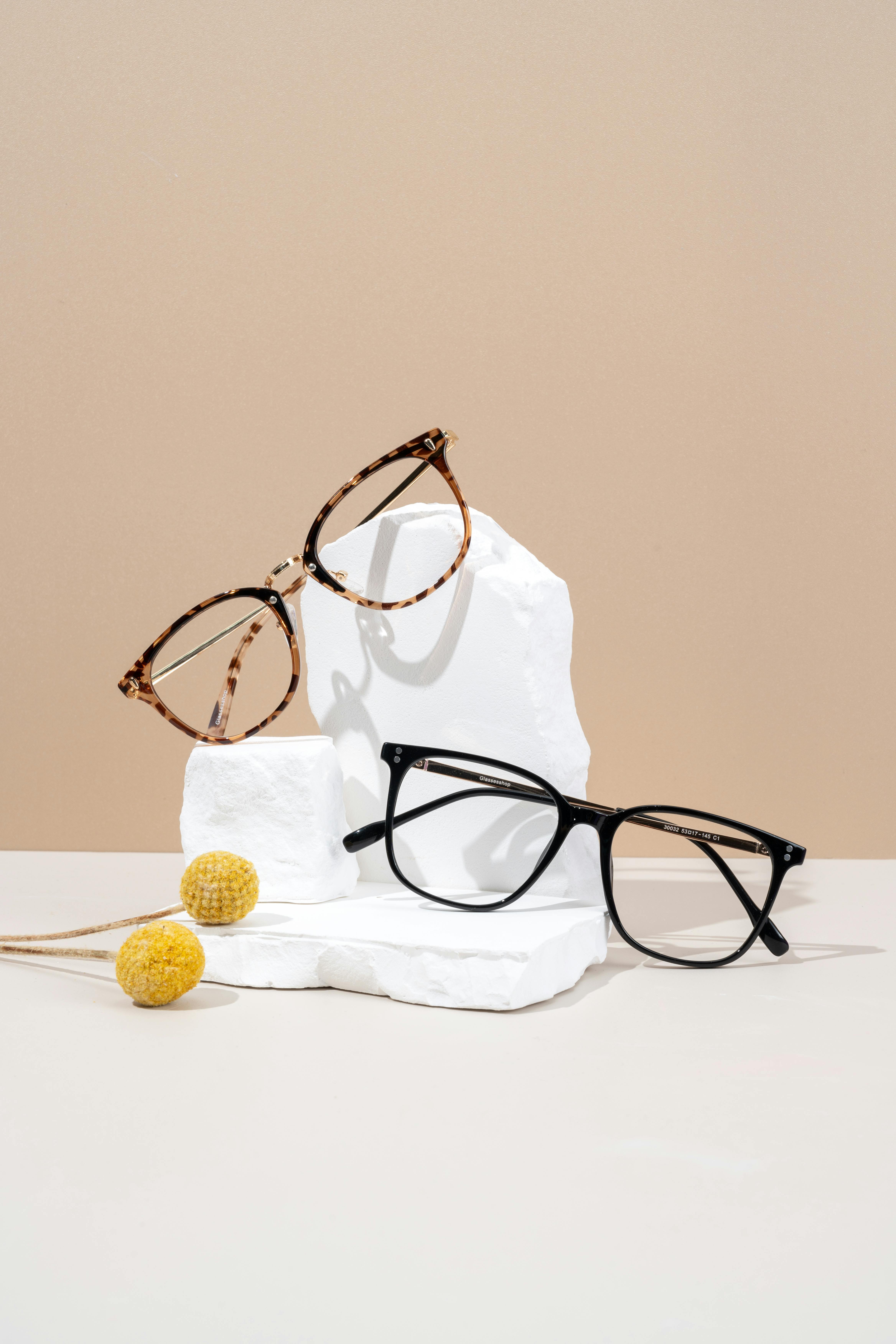 Elegant Eyewear Display on Minimalist Background · Free Stock Photo
