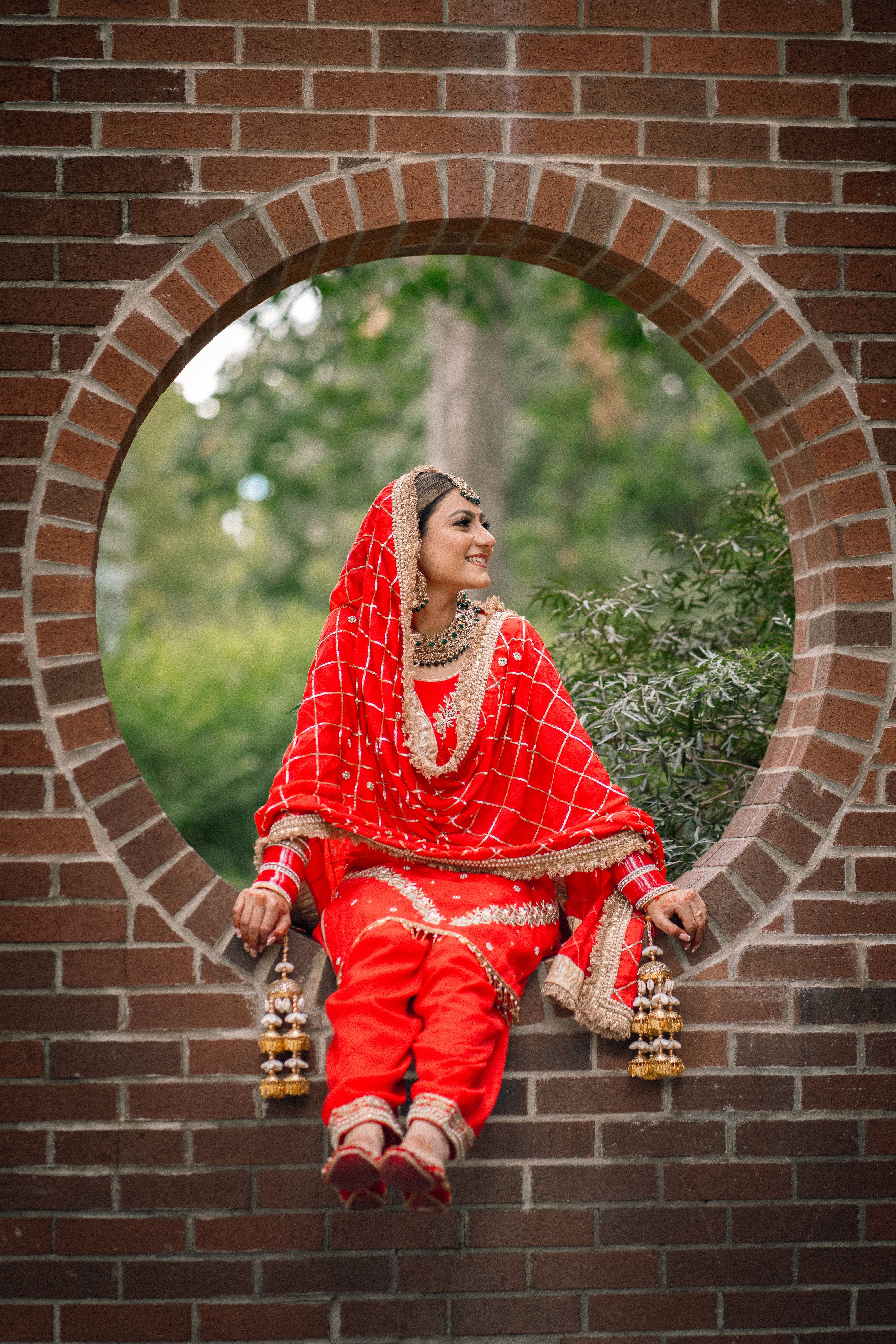 Elegant Bride in Traditional Red Attire · Free Stock Photo