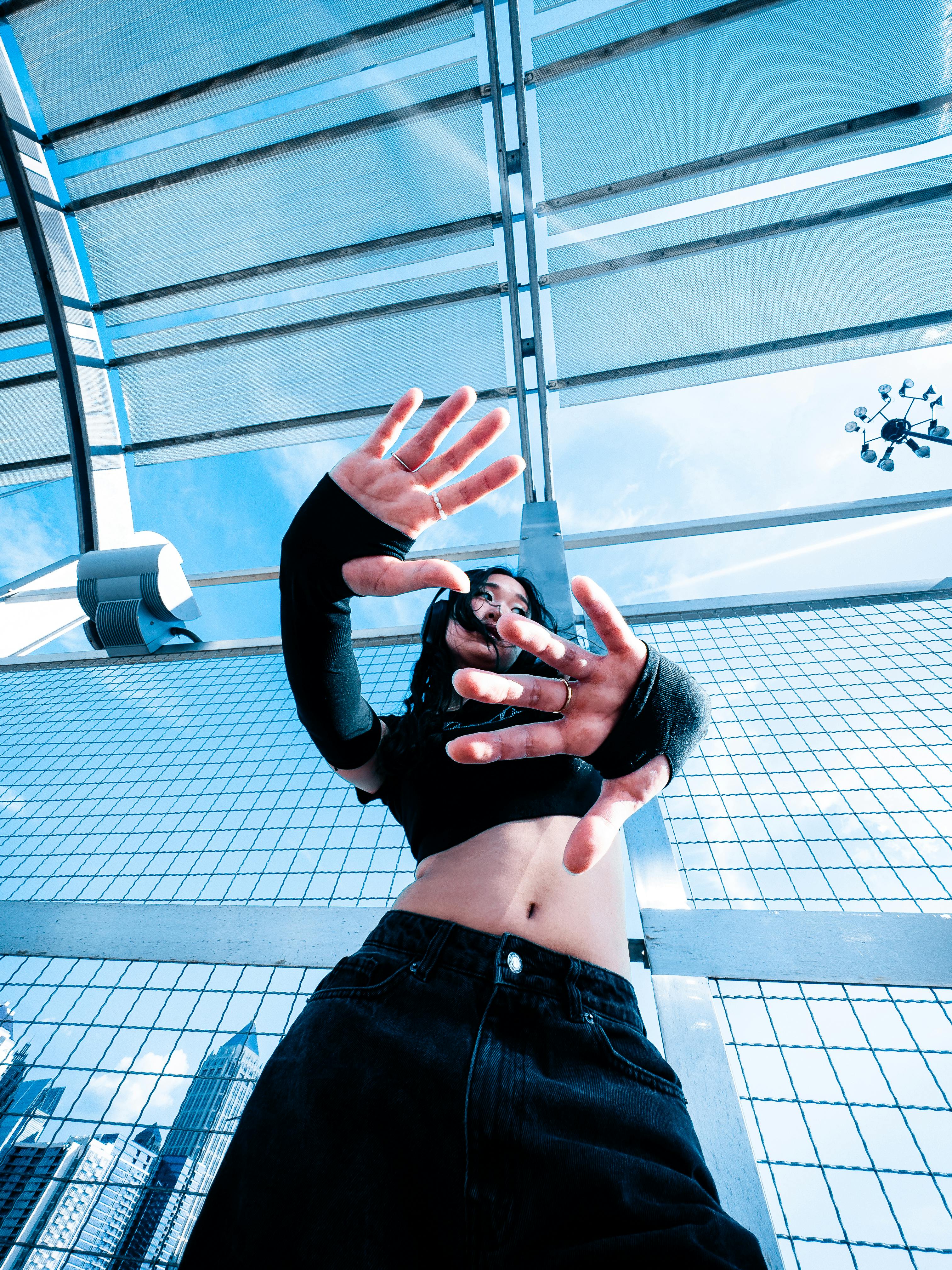 Dynamic Low Angle Fashion Portrait in Urban Setting · Free Stock Photo