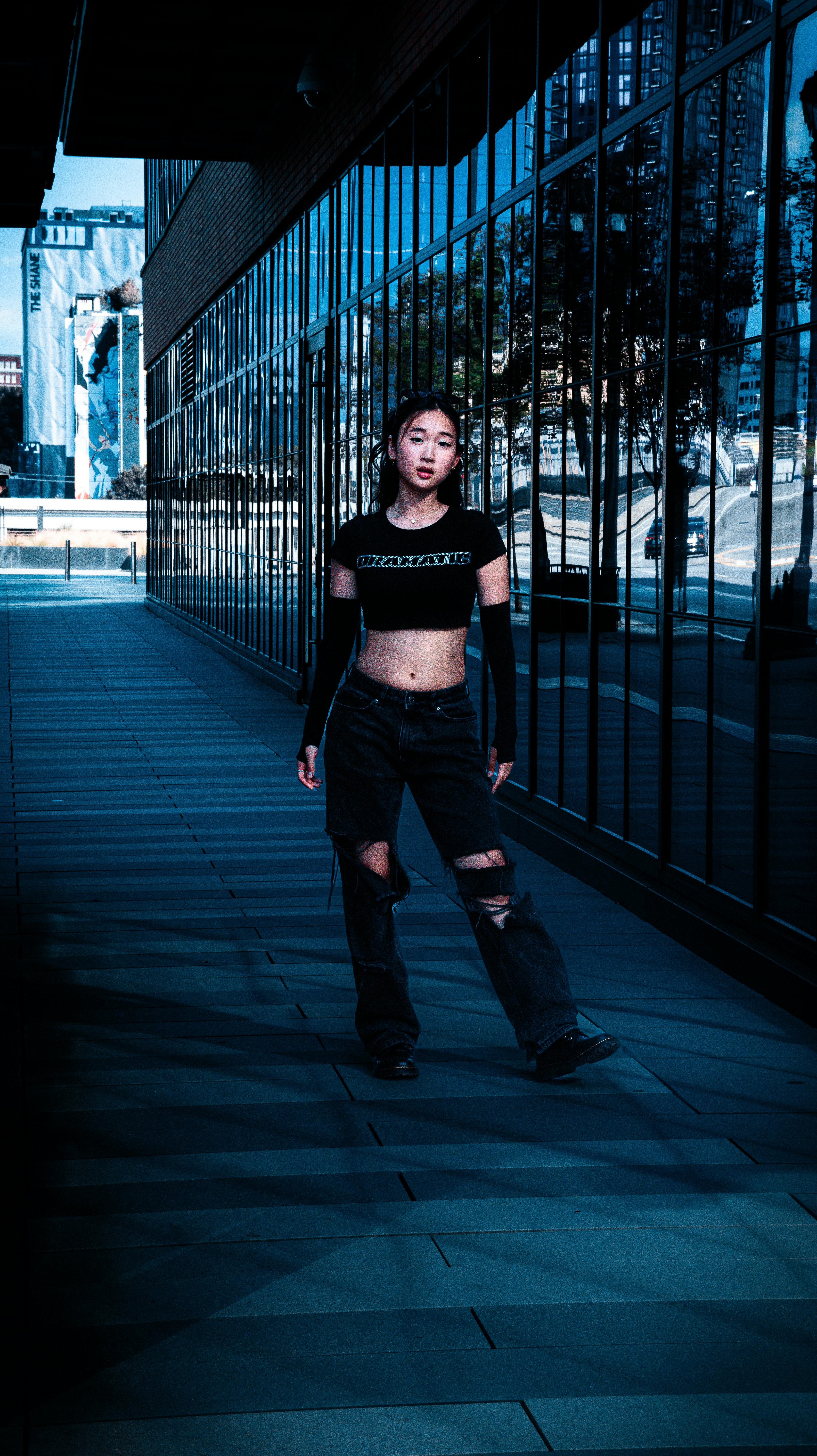 Dynamic Low Angle Fashion Portrait in Urban Setting · Free Stock Photo