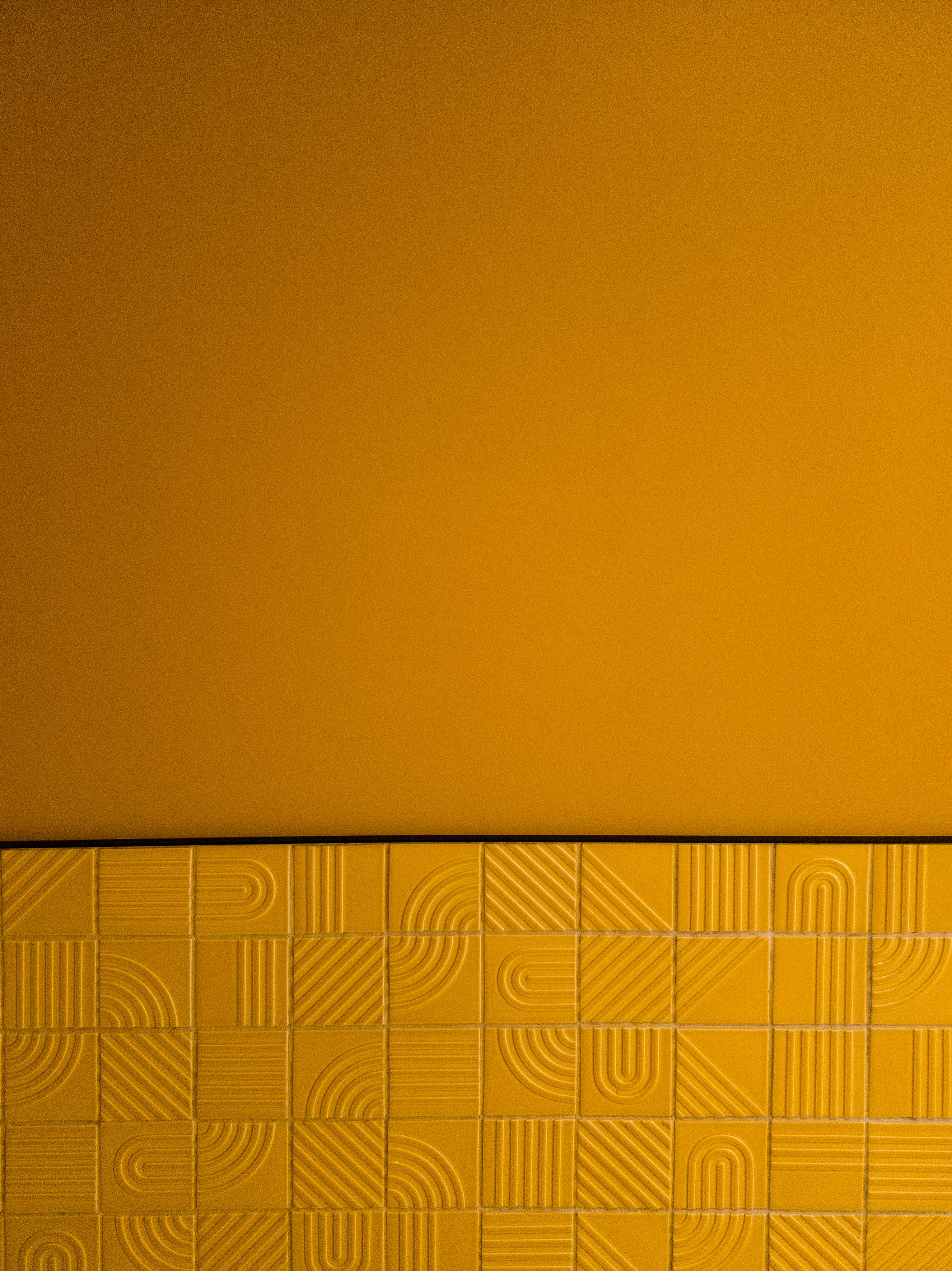 Modern Yellow Textured Wall Design · Free Stock Photo