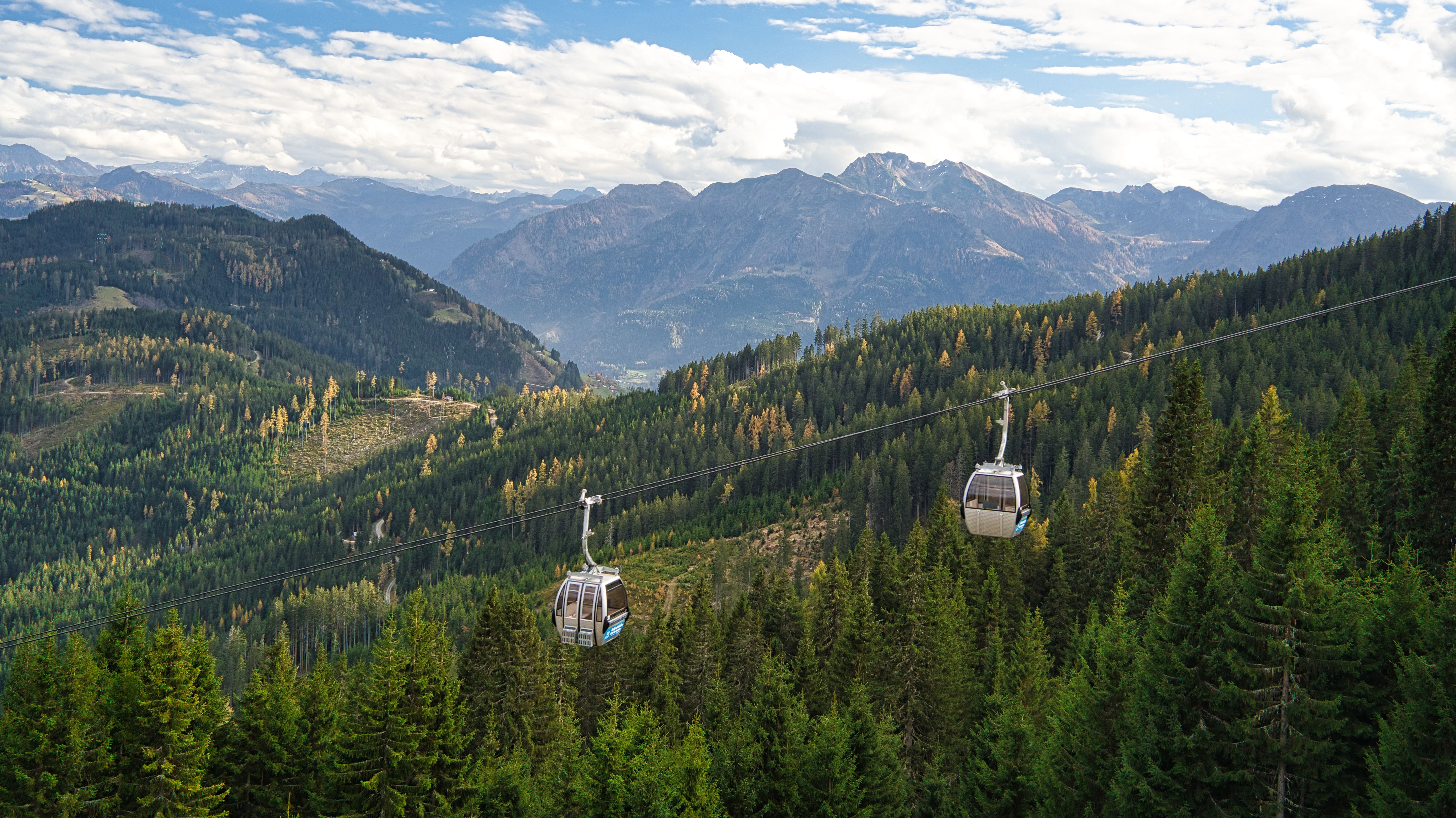 Scenic Alpine Cable Car Journey Through Fall Landscape · Free Stock Photo