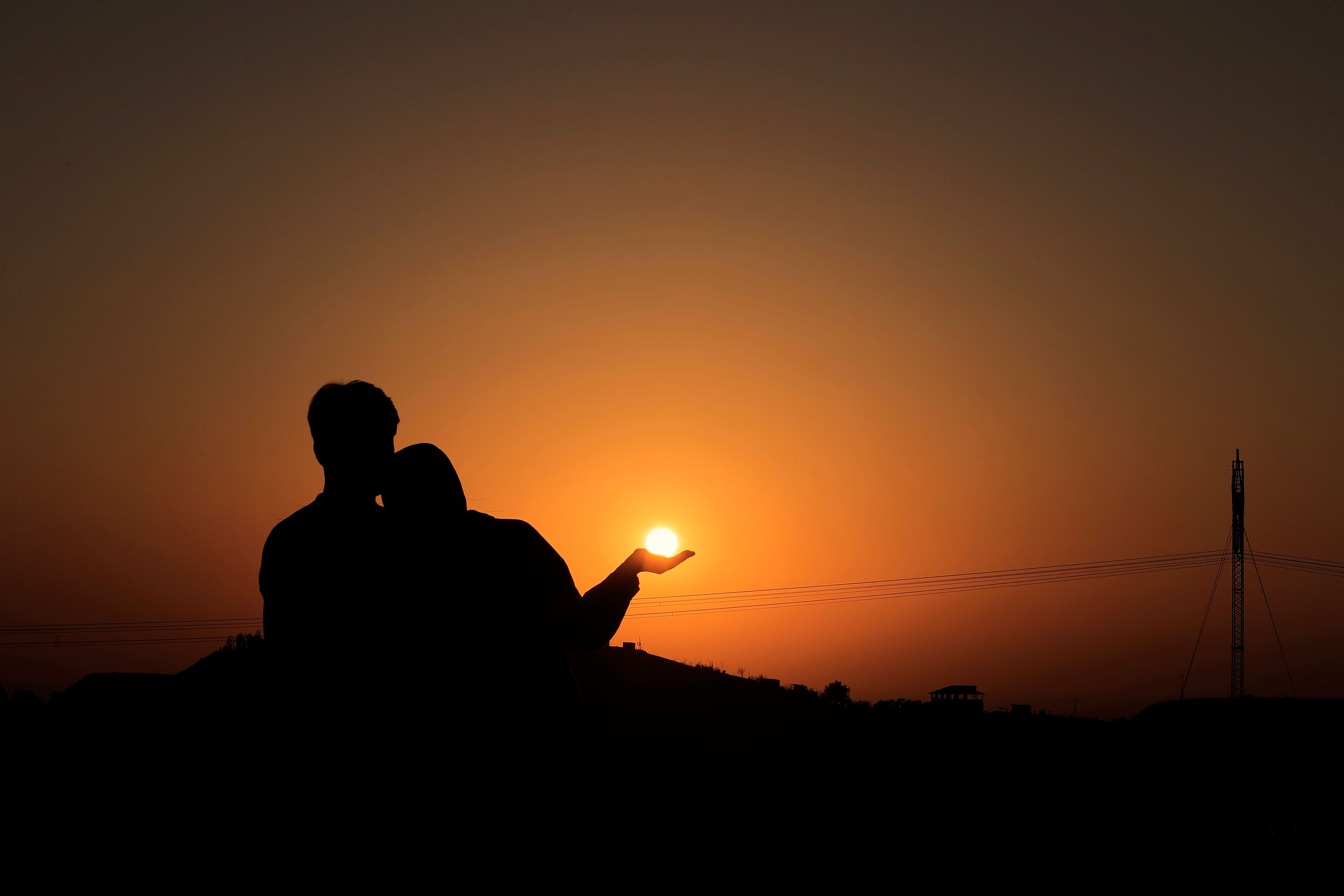 Romantic Sunset Silhouette of a Couple · Free Stock Photo