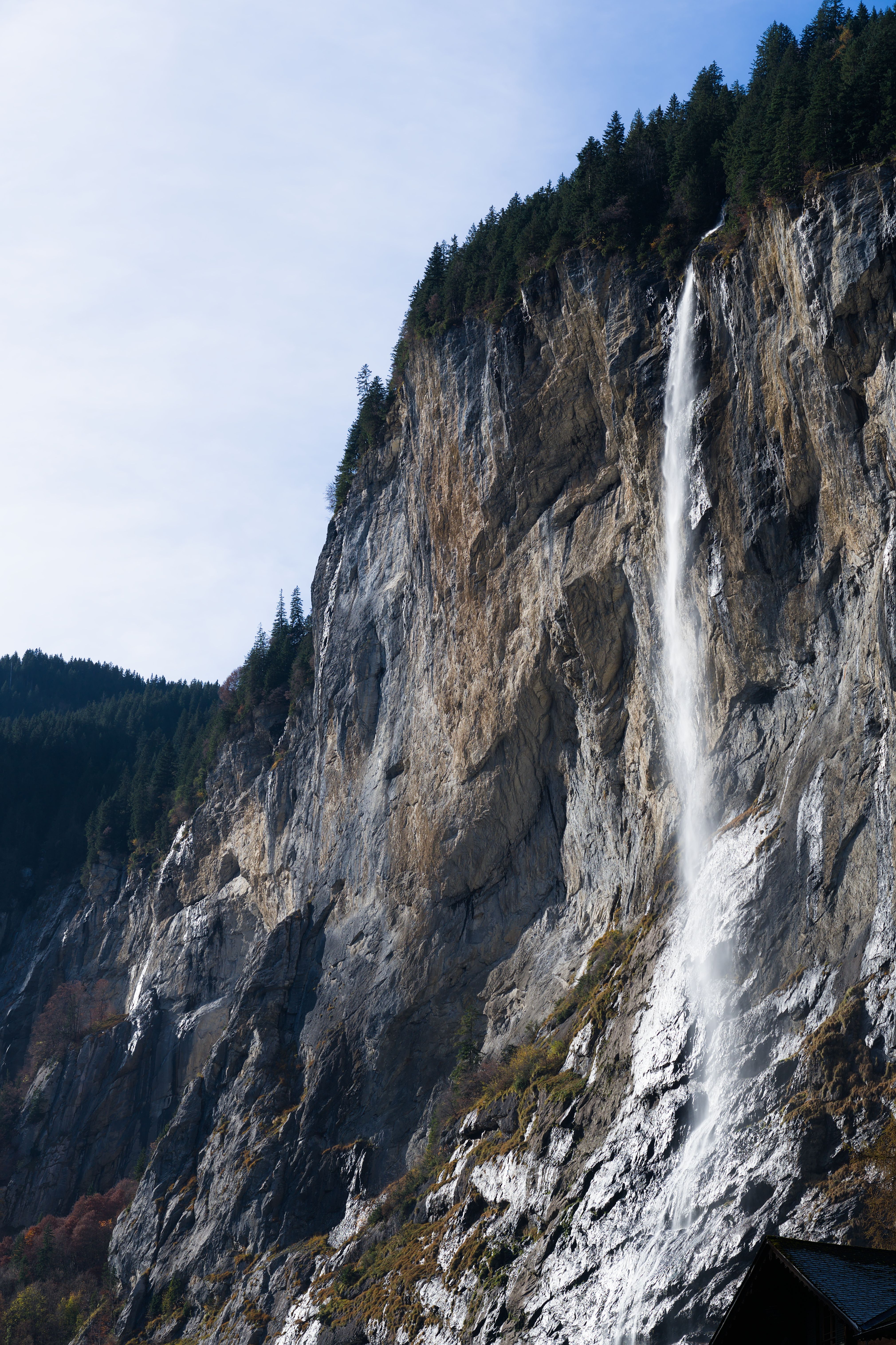 Stunning Waterfall Cascading Down Swiss Alps · Free Stock Photo