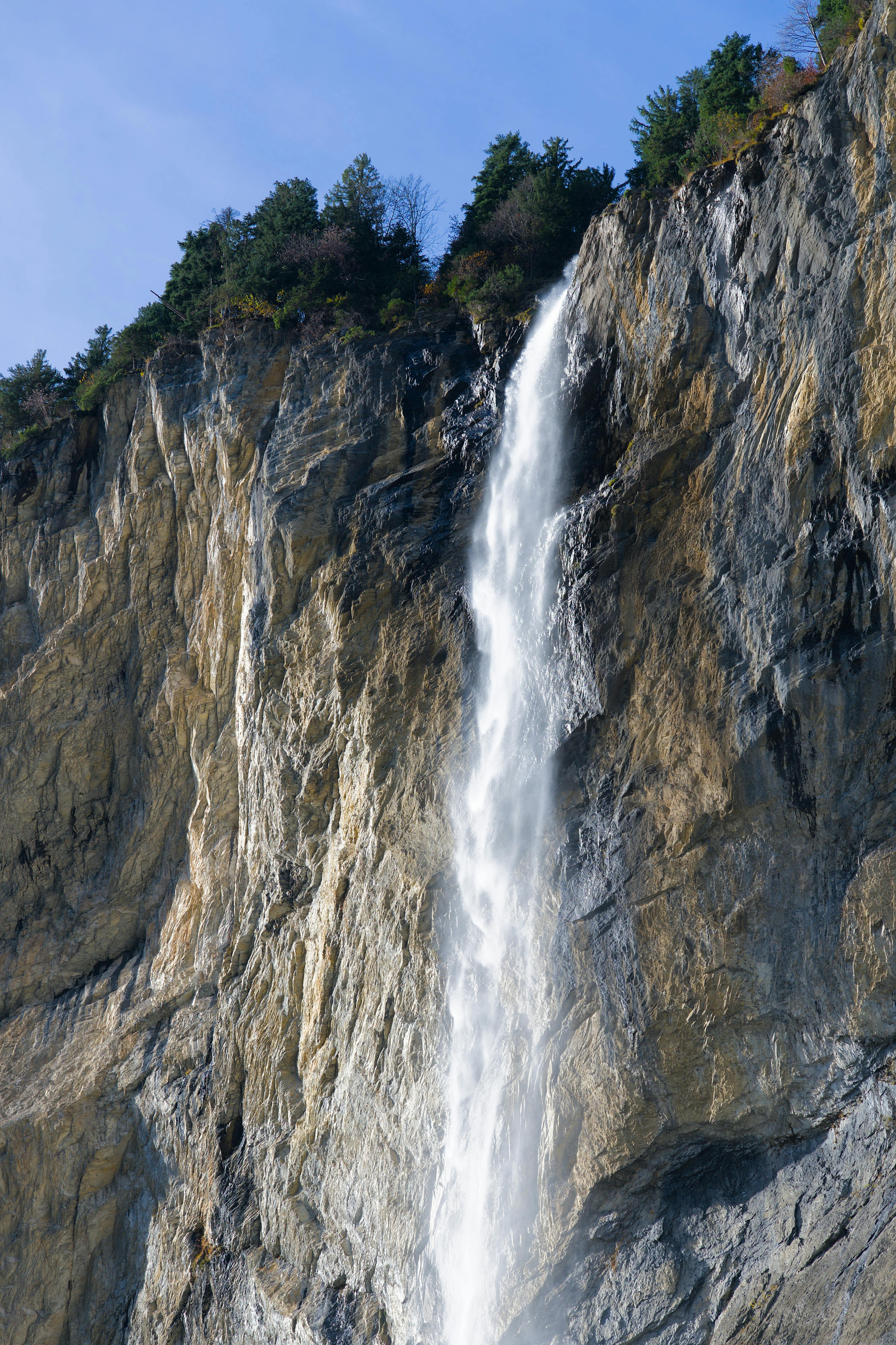Stunning Waterfall in Swiss Alps Landscape · Free Stock Photo