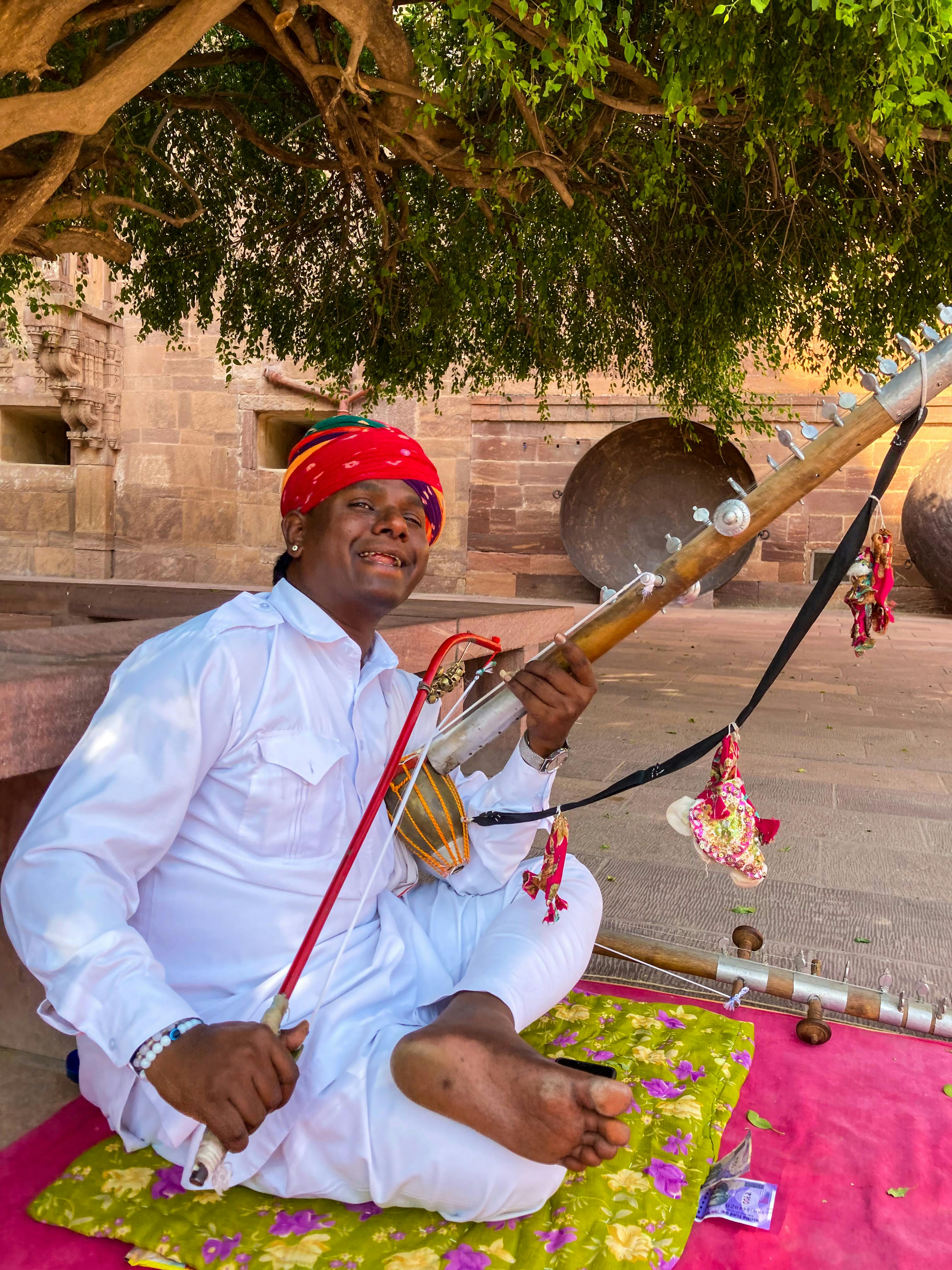 Indian Musician Playing Traditional Instrument · Free Stock Photo