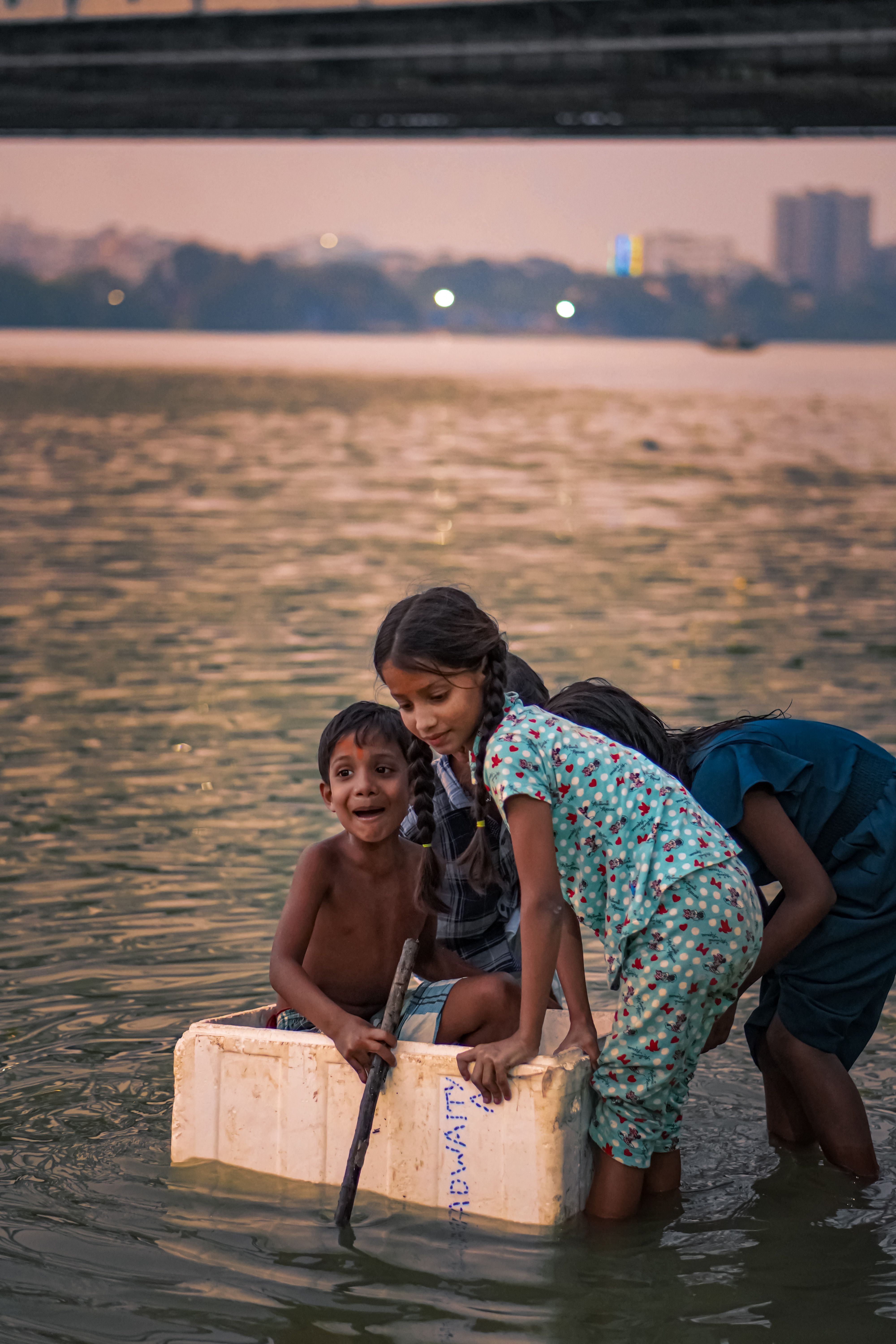 Children Playing in River at Sunset · Free Stock Photo