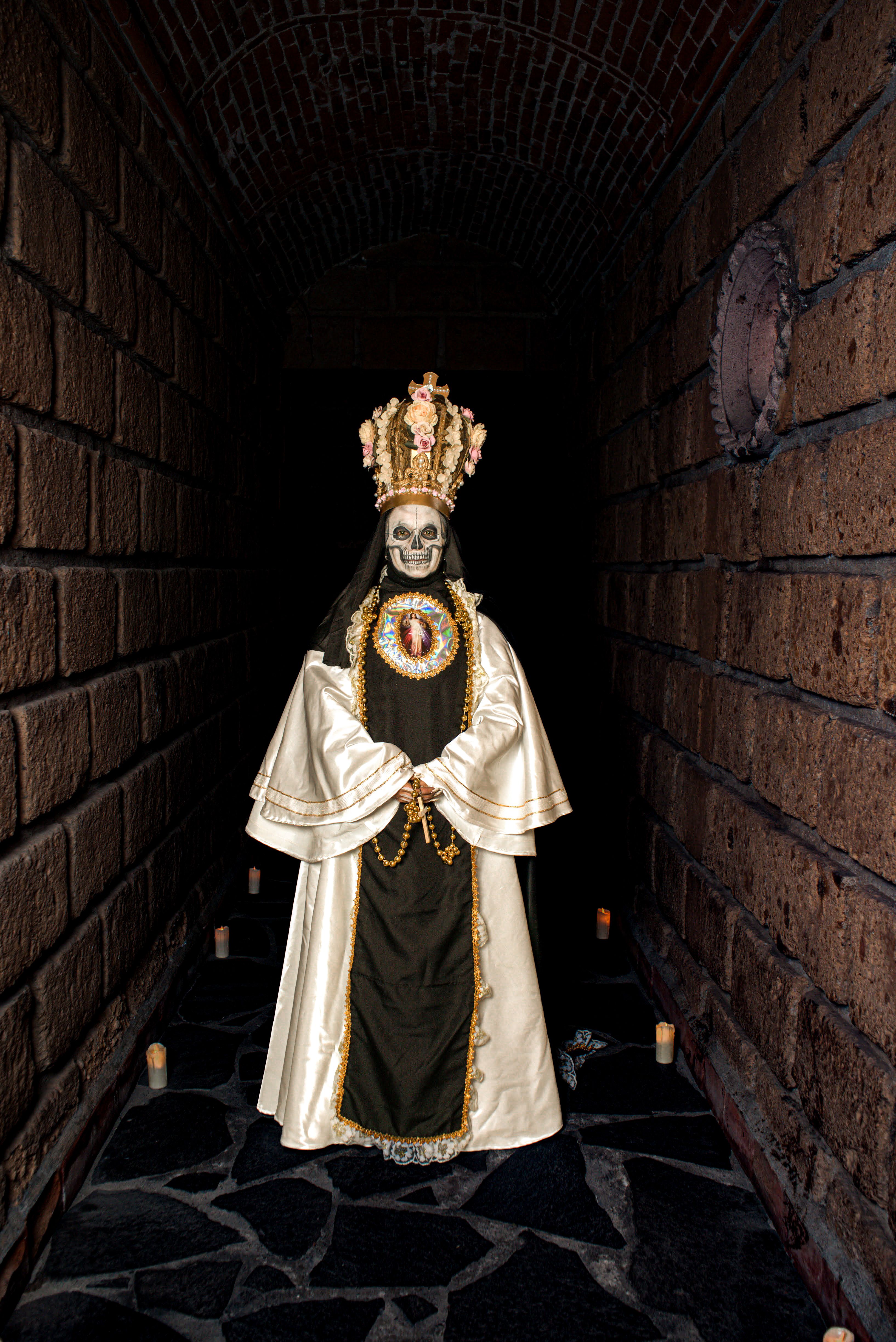 Mystical Skeleton Figure in Dark Passageway · Free Stock Photo