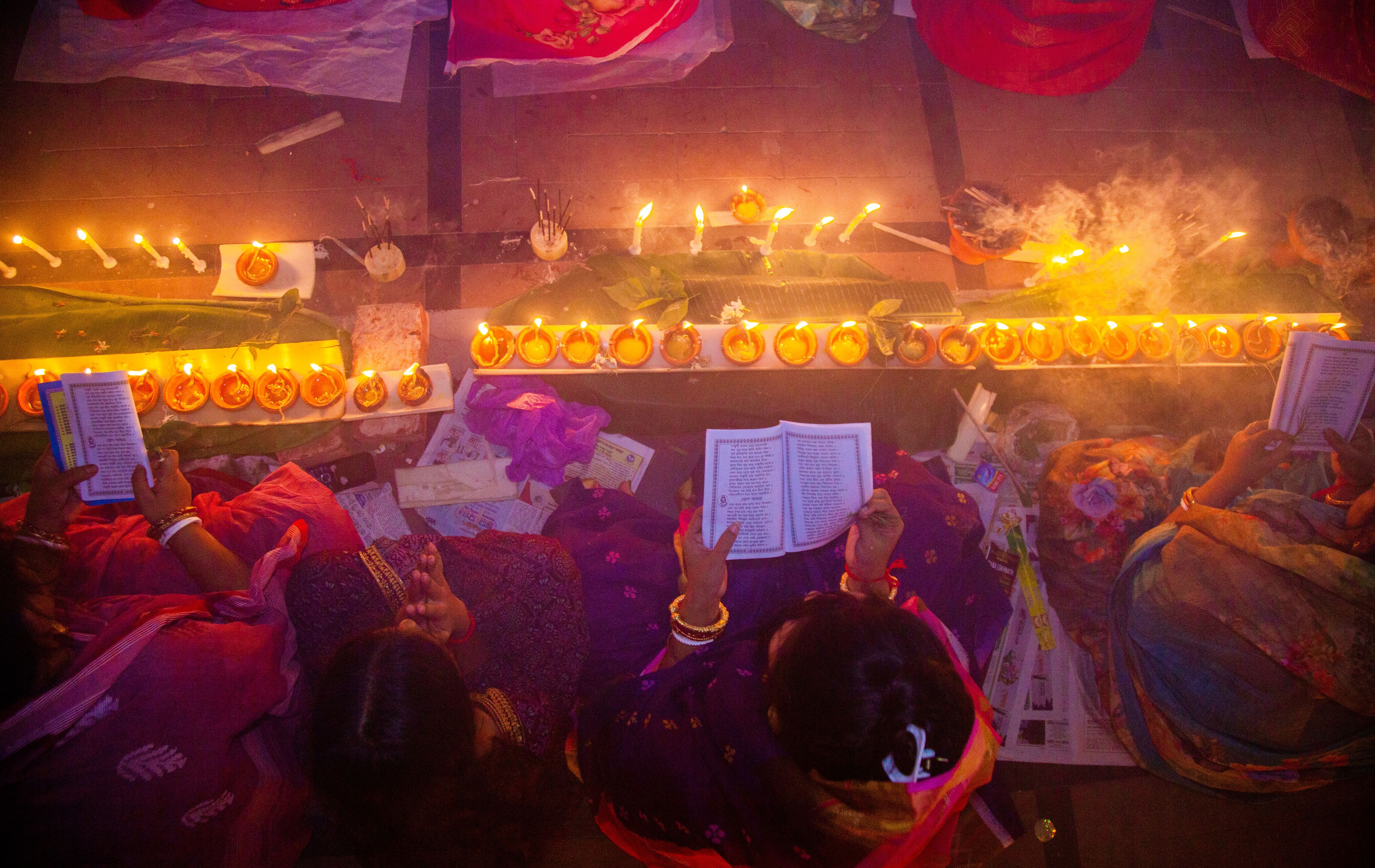 Traditional Prayer Ceremony with Candles and Books · Free Stock Photo