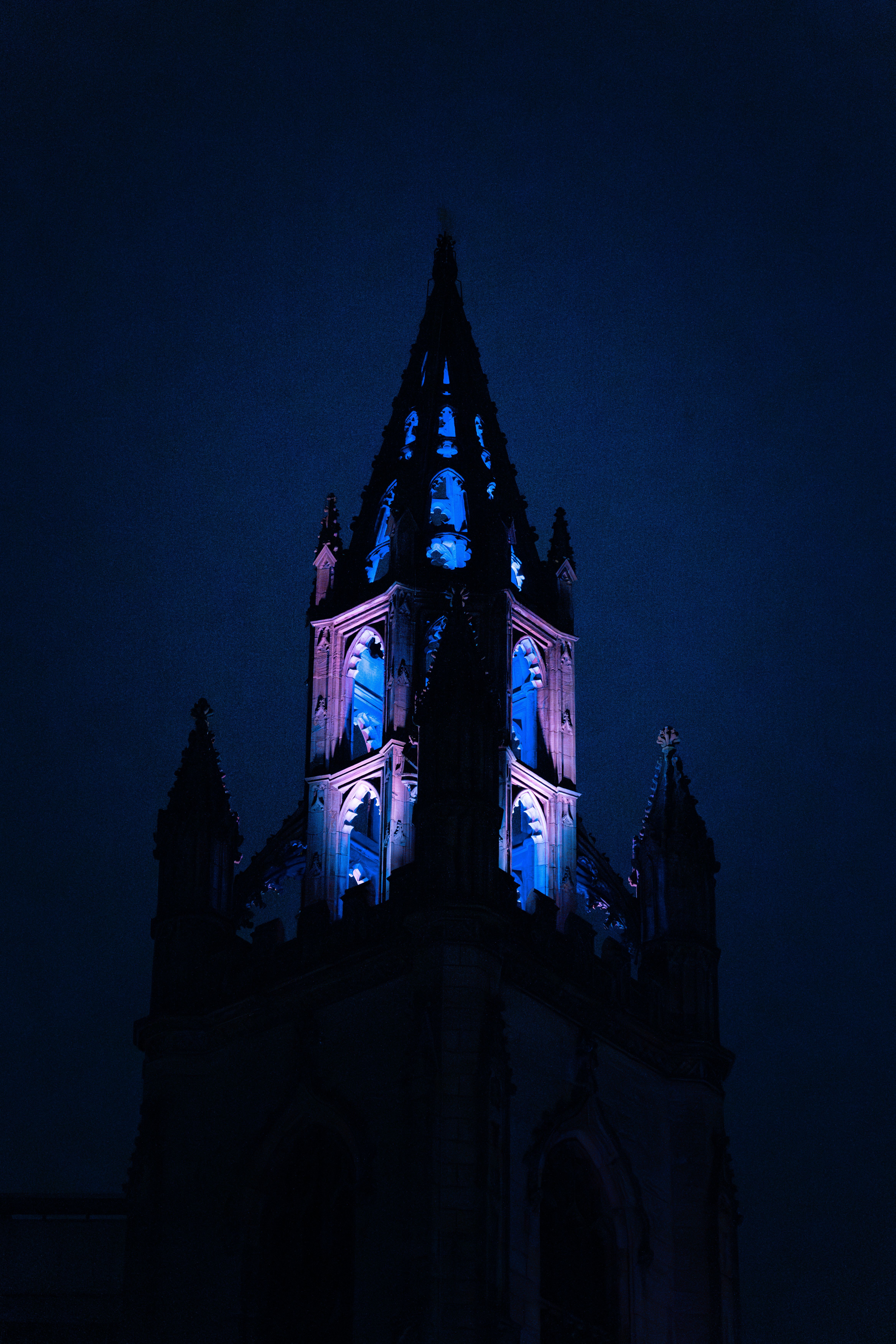 Gothic Cathedral Spire Illuminated at Night · Free Stock Photo