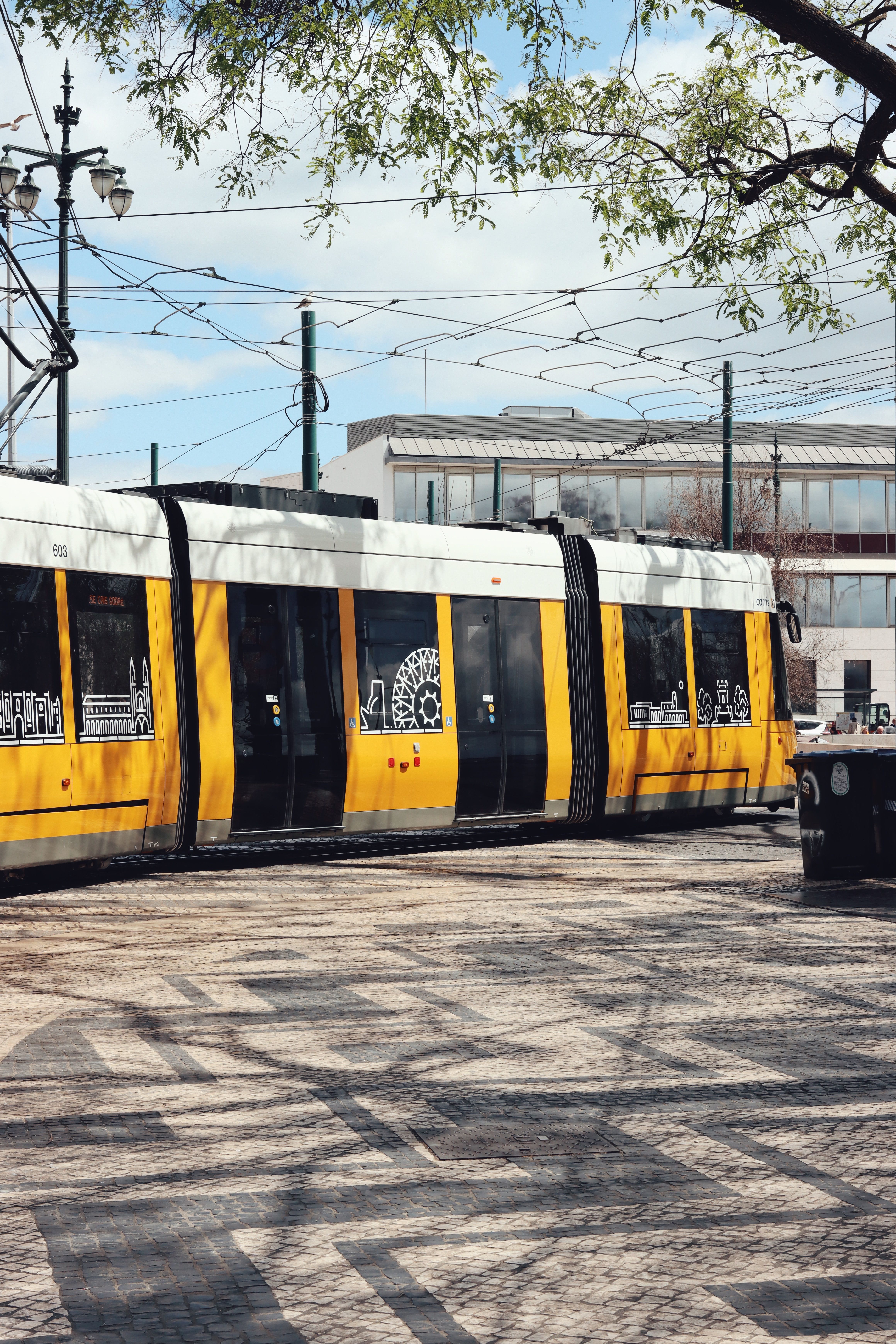 Vibrant Yellow Tram in Historic Lisbon Street · Free Stock Photo