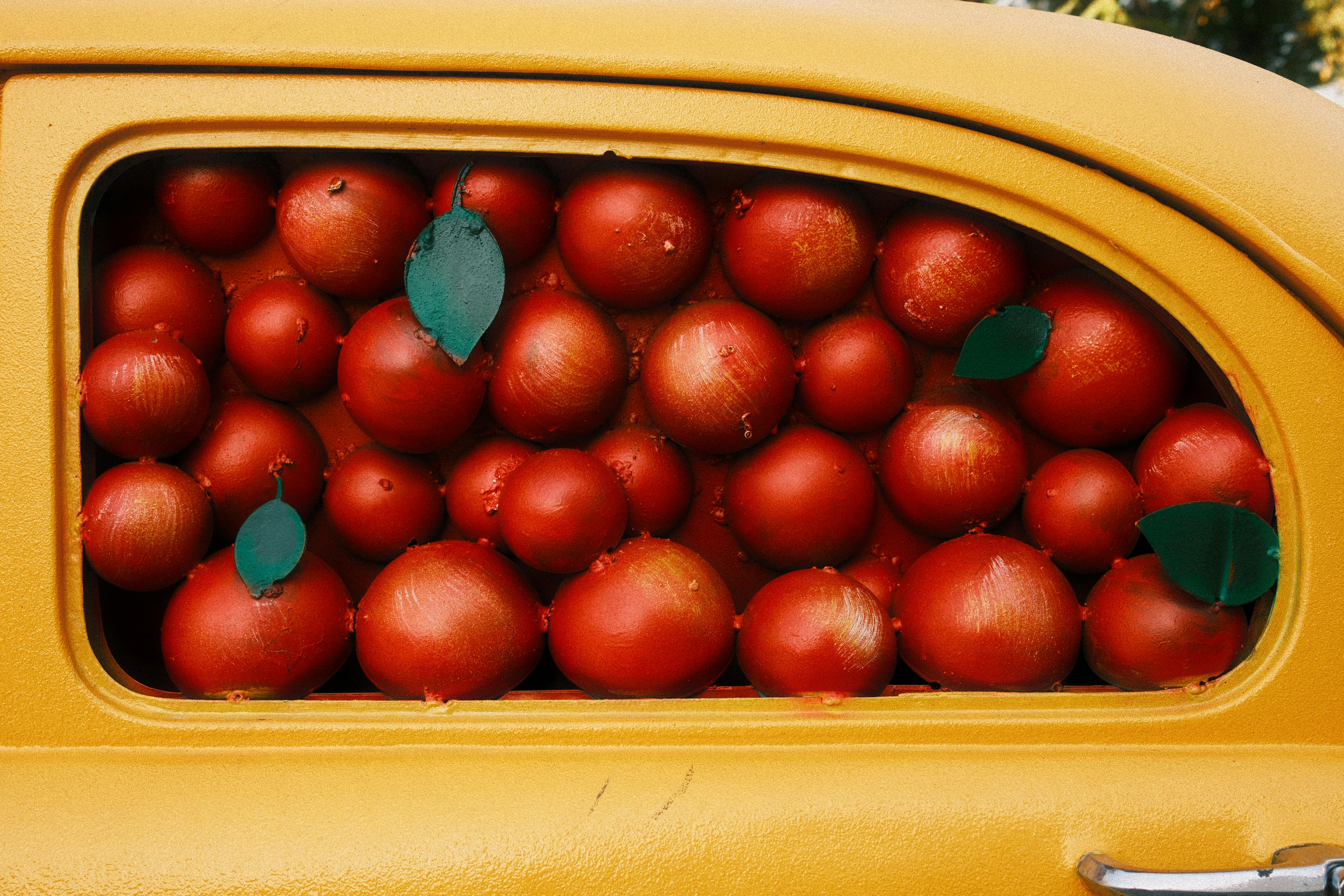 Vintage Yellow Car Filled with Red Apples · Free Stock Photo