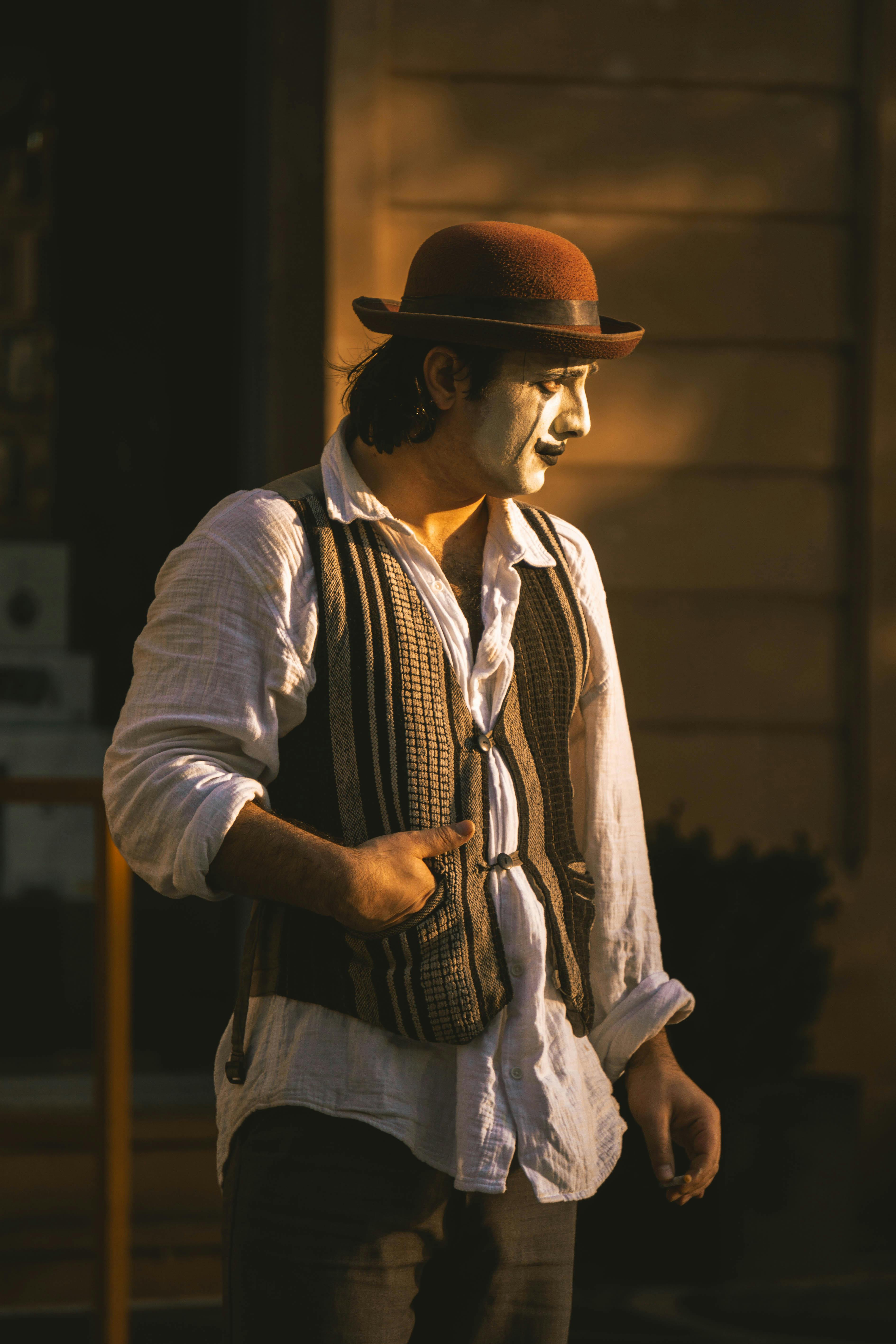 Street Performer in Classic Mime Attire at Sunset · Free Stock Photo